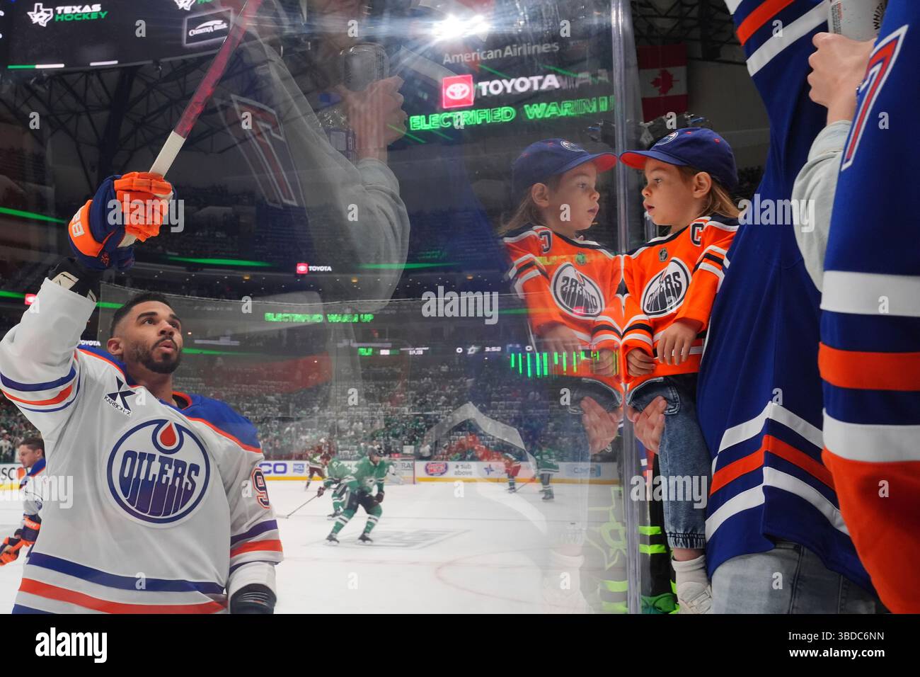 Edmonton Oilers fans, right, look on during warmups before Game 2 of ...