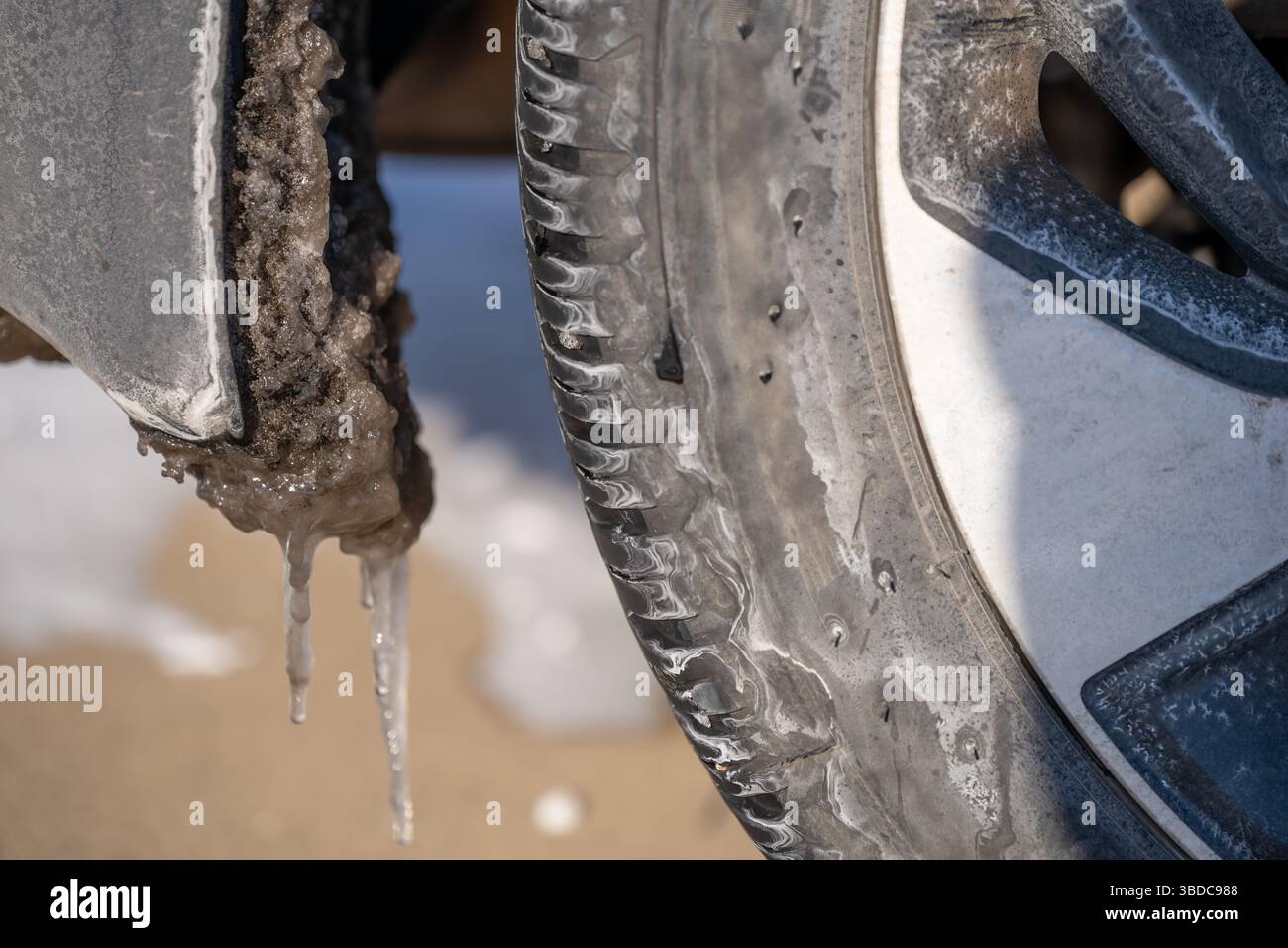 built up ice and snow on the rear tire wheel-well Stock Photo - Alamy