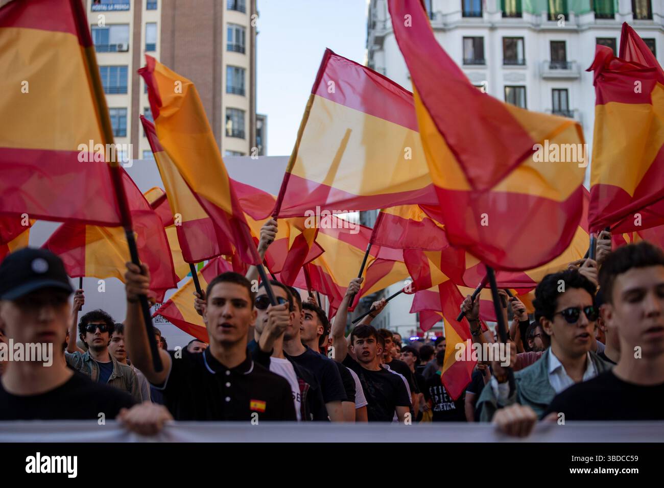 Madrid, Spain. 23rd May, 2025. A crowd of protesters holds Spanish ...