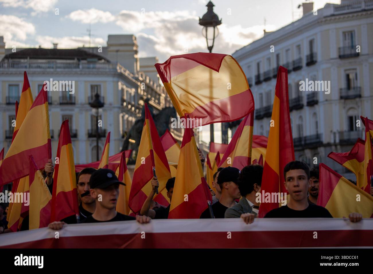 Madrid, Spain. 23rd May, 2025. A crowd of protesters holds Spanish ...