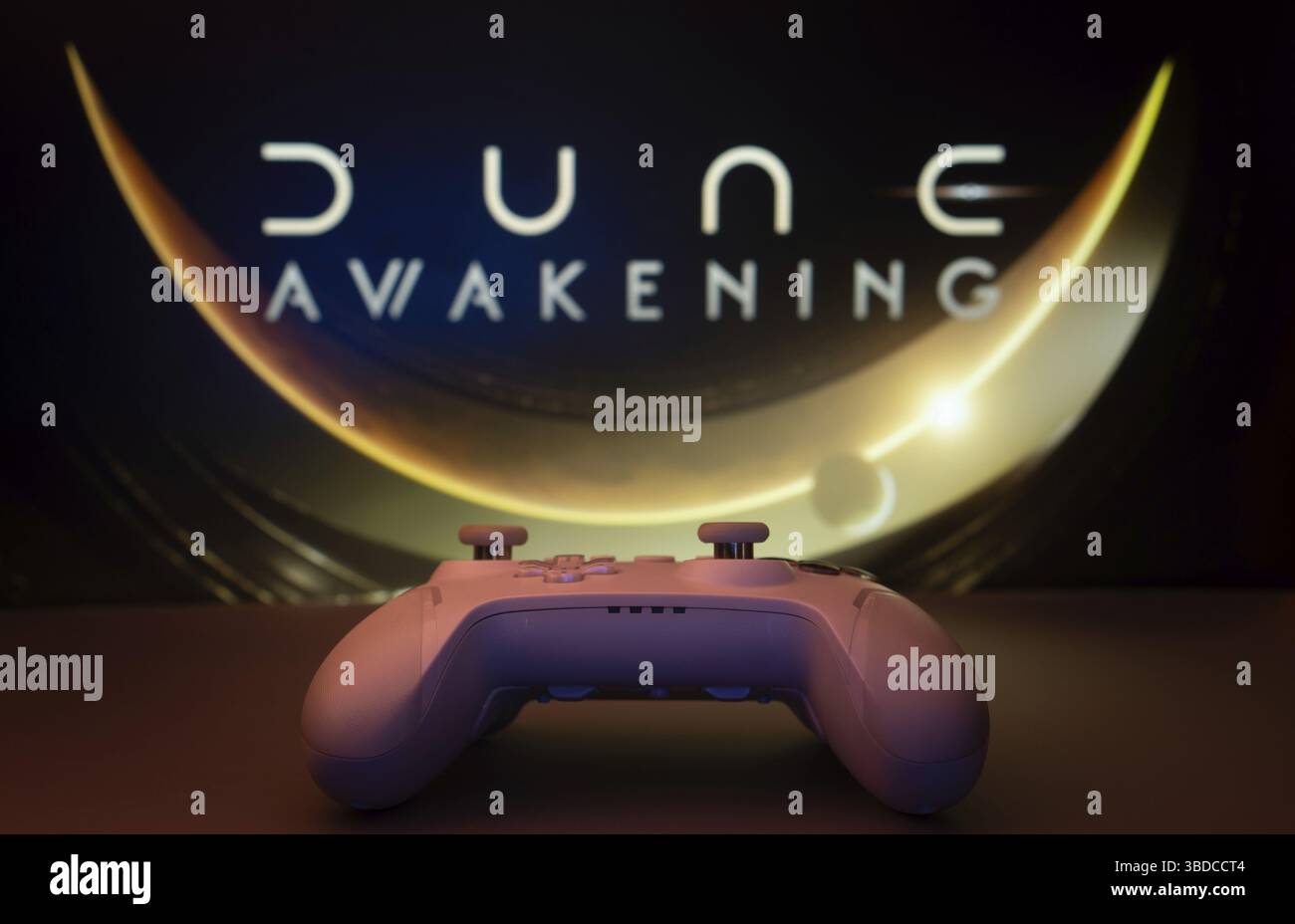 Dhaka, Bangladesh- 21 May 2025: A game controller in focus with Dune ...