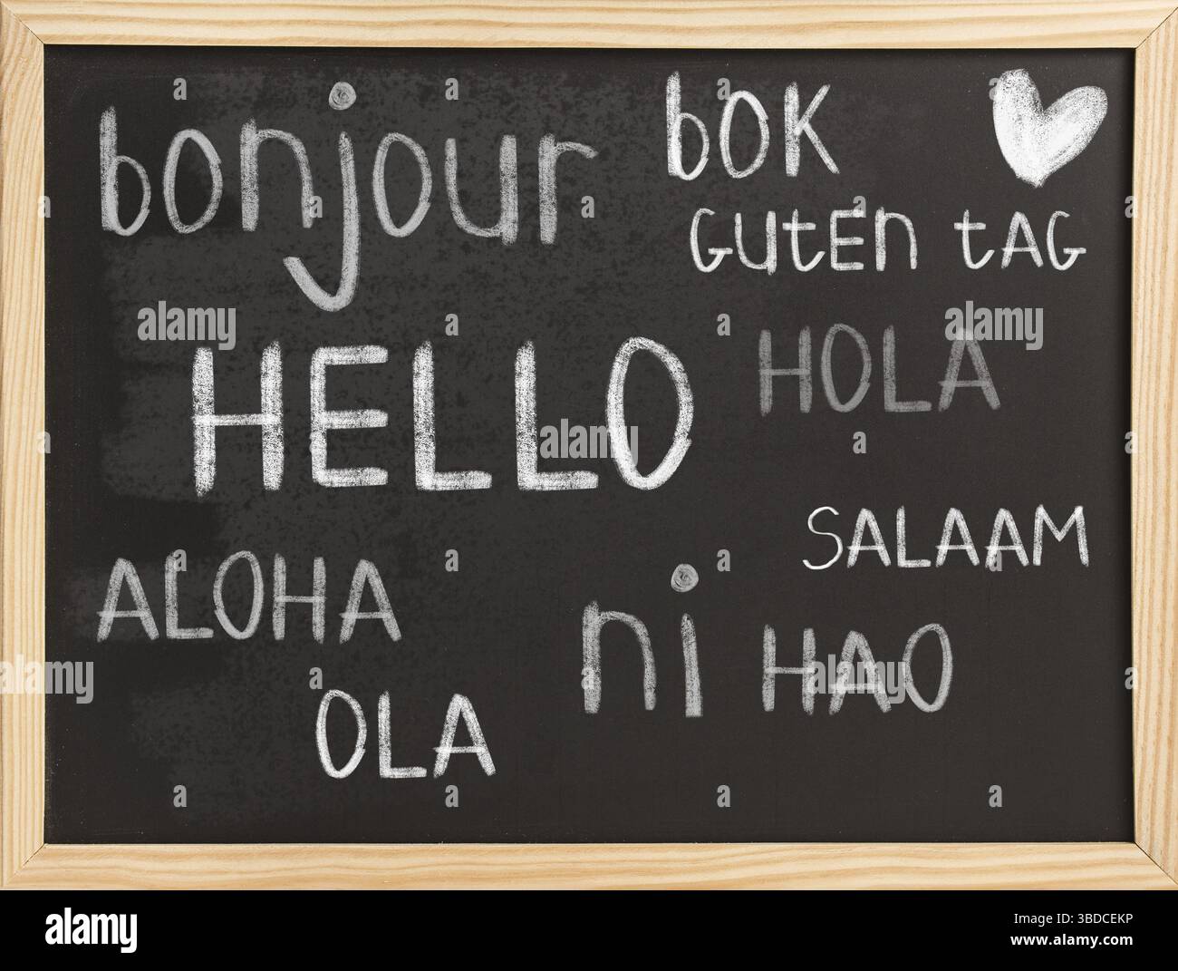 Hello in different languages on chalkboard background Stock Photo - Alamy