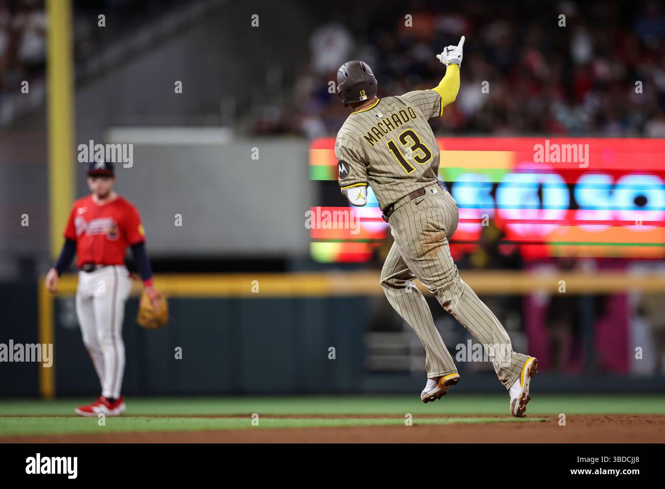 San Diego Padres' Manny Machado hits a home run in the ninth inning of ...
