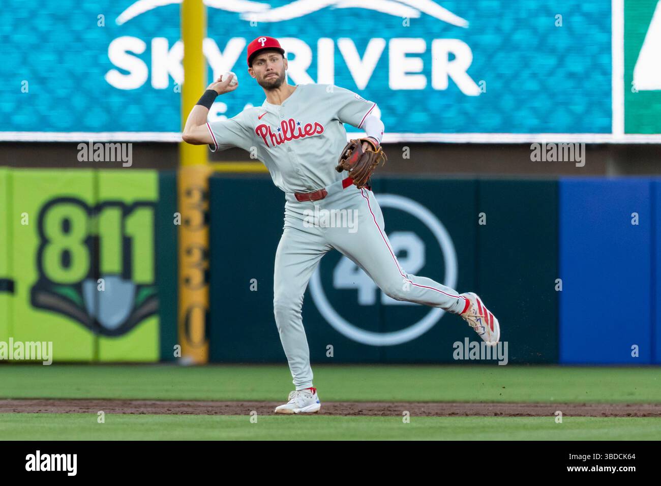 Philadelphia Phillies shortstop Trea Turner throws to first base for an ...
