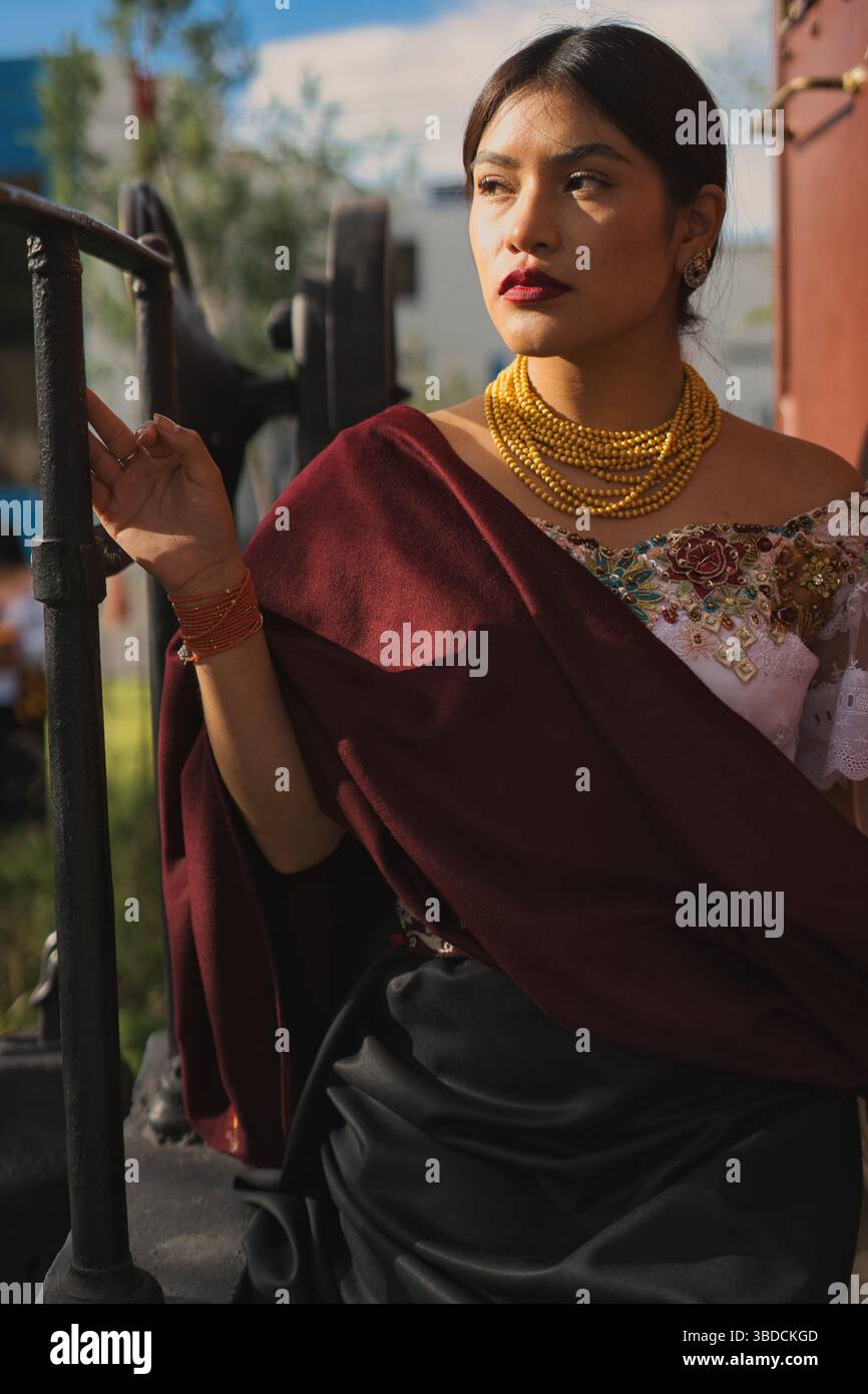 Indigenous fashion model poses outdoors in elegant traditional clothing ...