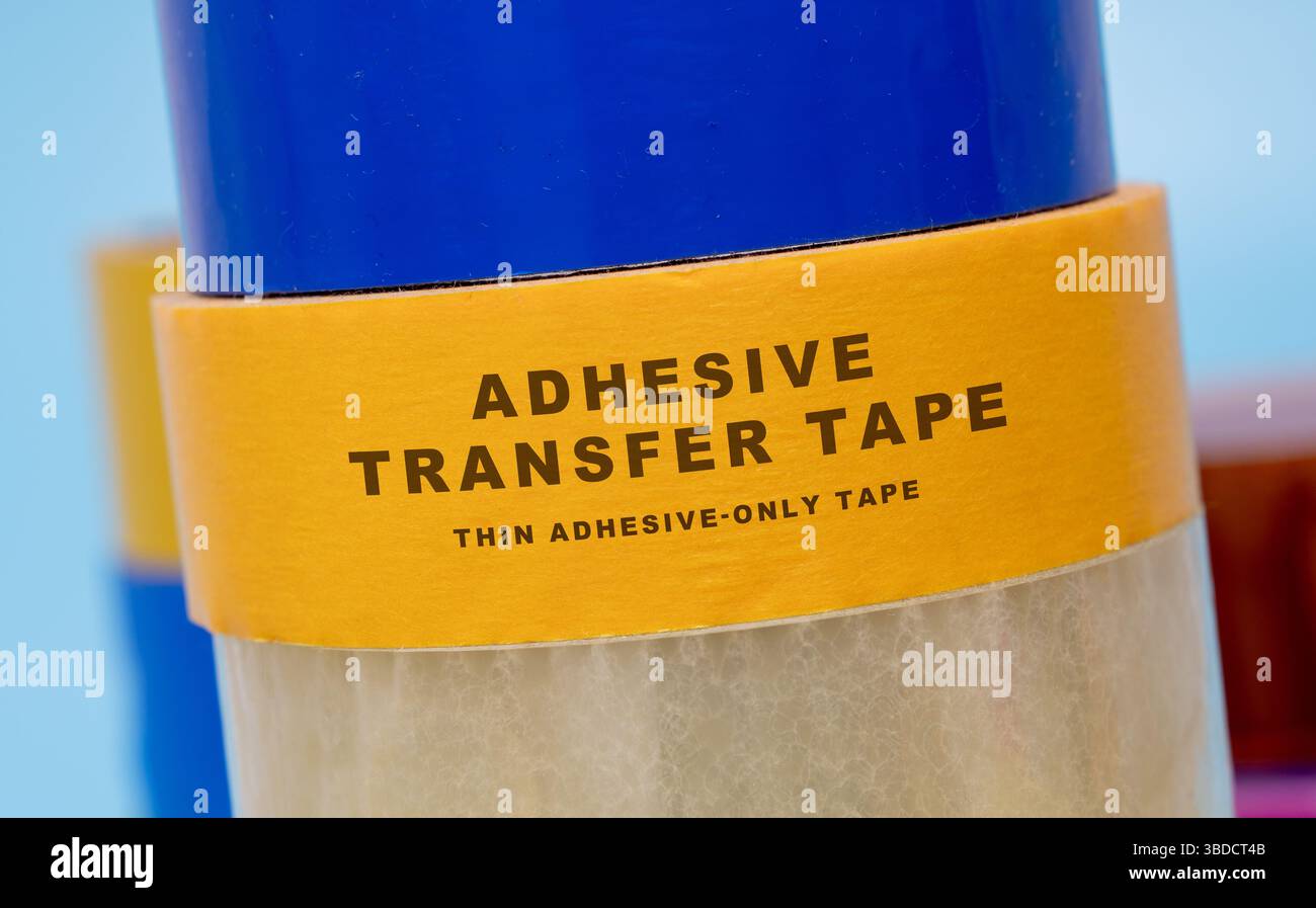 Adhesive transfer tape. Thin adhesive-only tape. Commonly used in ...