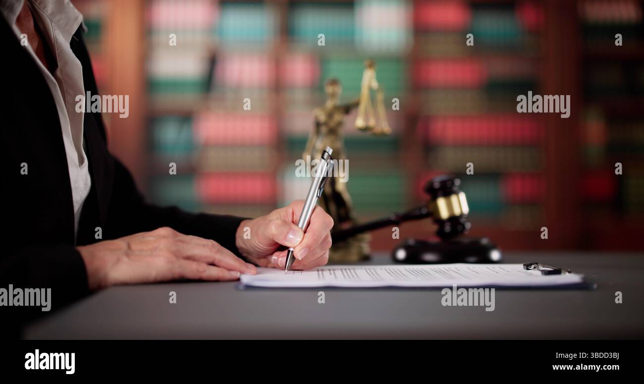 Female attorney signing arbitration hi-res stock photography and images ...