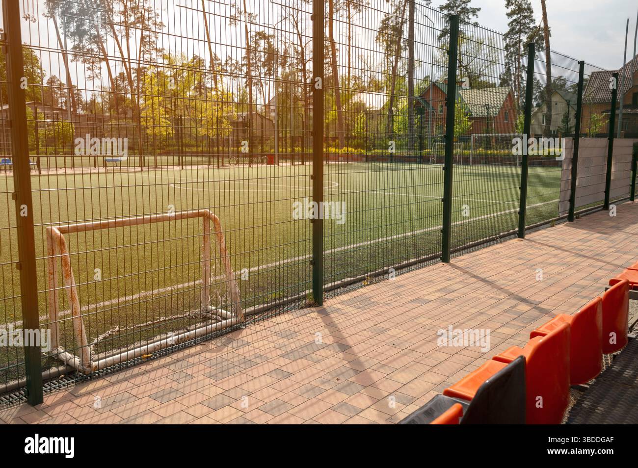 Small school stadium with high fence around it. High School Football ...