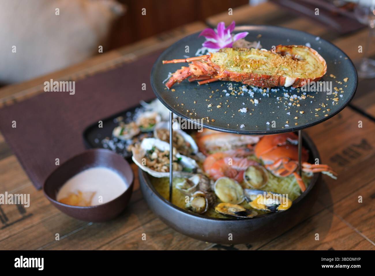 two-tiered luxury platter of lobster and seafood crabs shrimp langoustines shellfish delicious ...