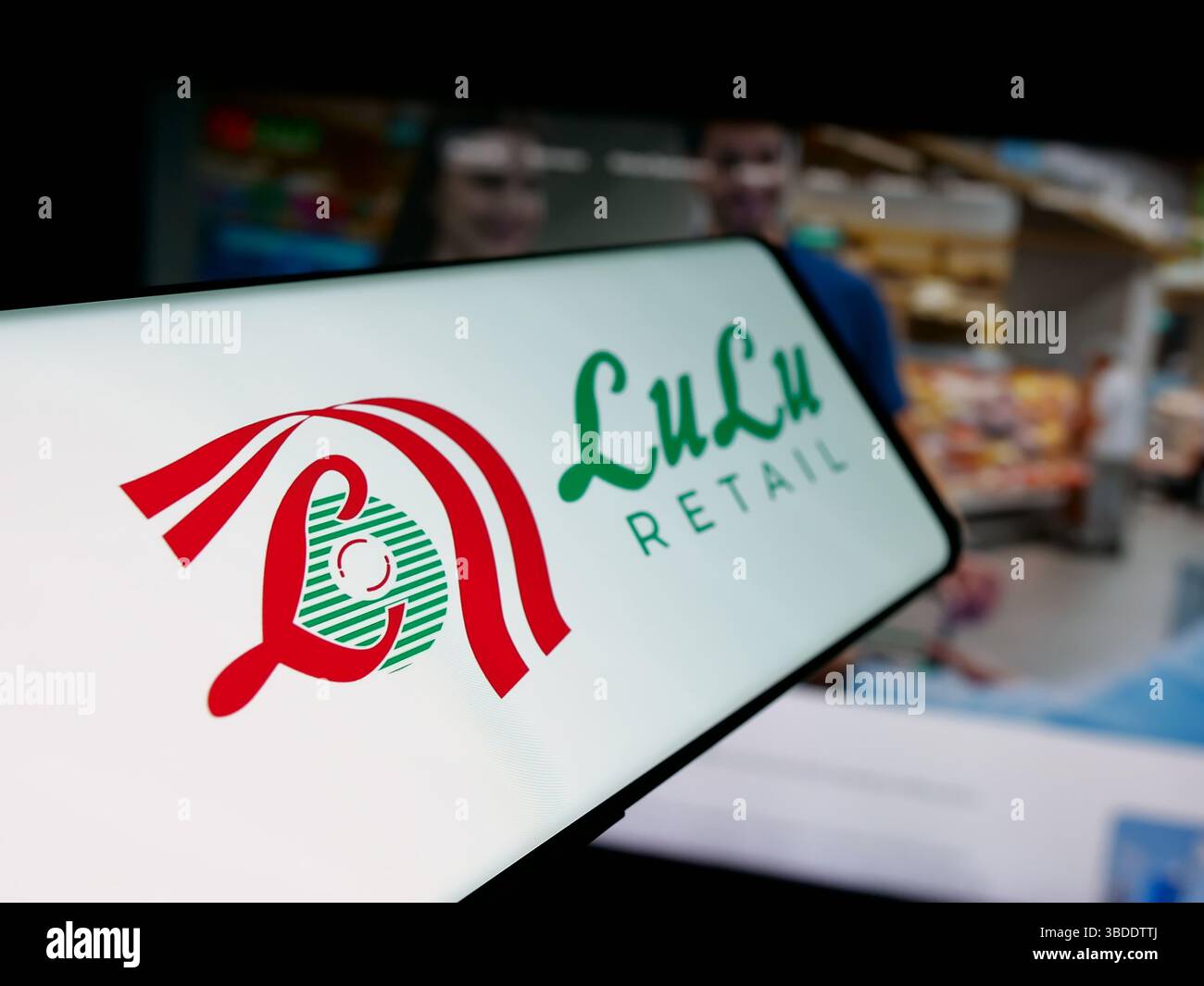 In this photo illustration, a smartphone with the logo of company Lulu ...