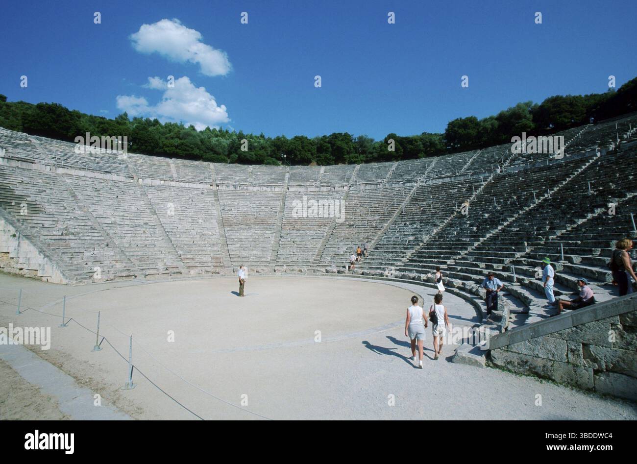 Tourists in amphitheatre of Epidaurus, sanctuary of Asclepieion ...