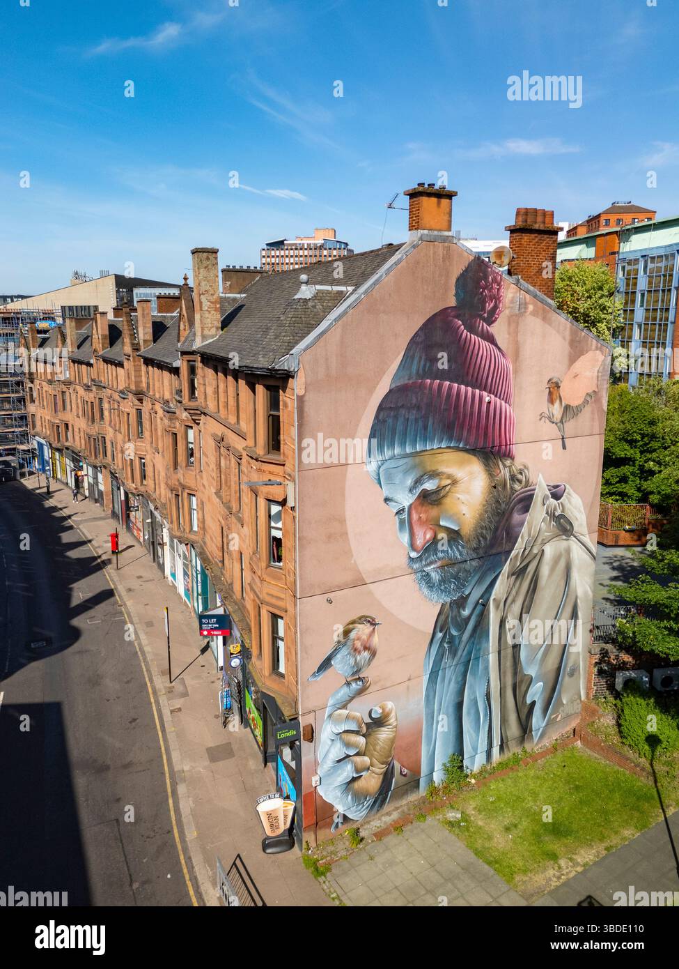 Aerial view of large mural on gable-end of tenement building on High ...