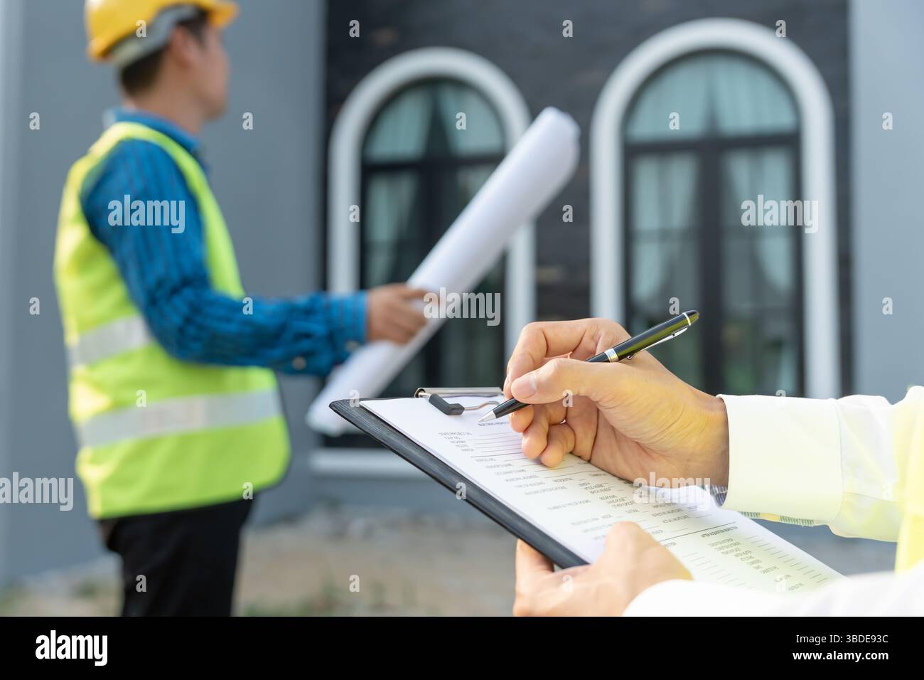 engineer is inspecting construction and quality assurance new house ...