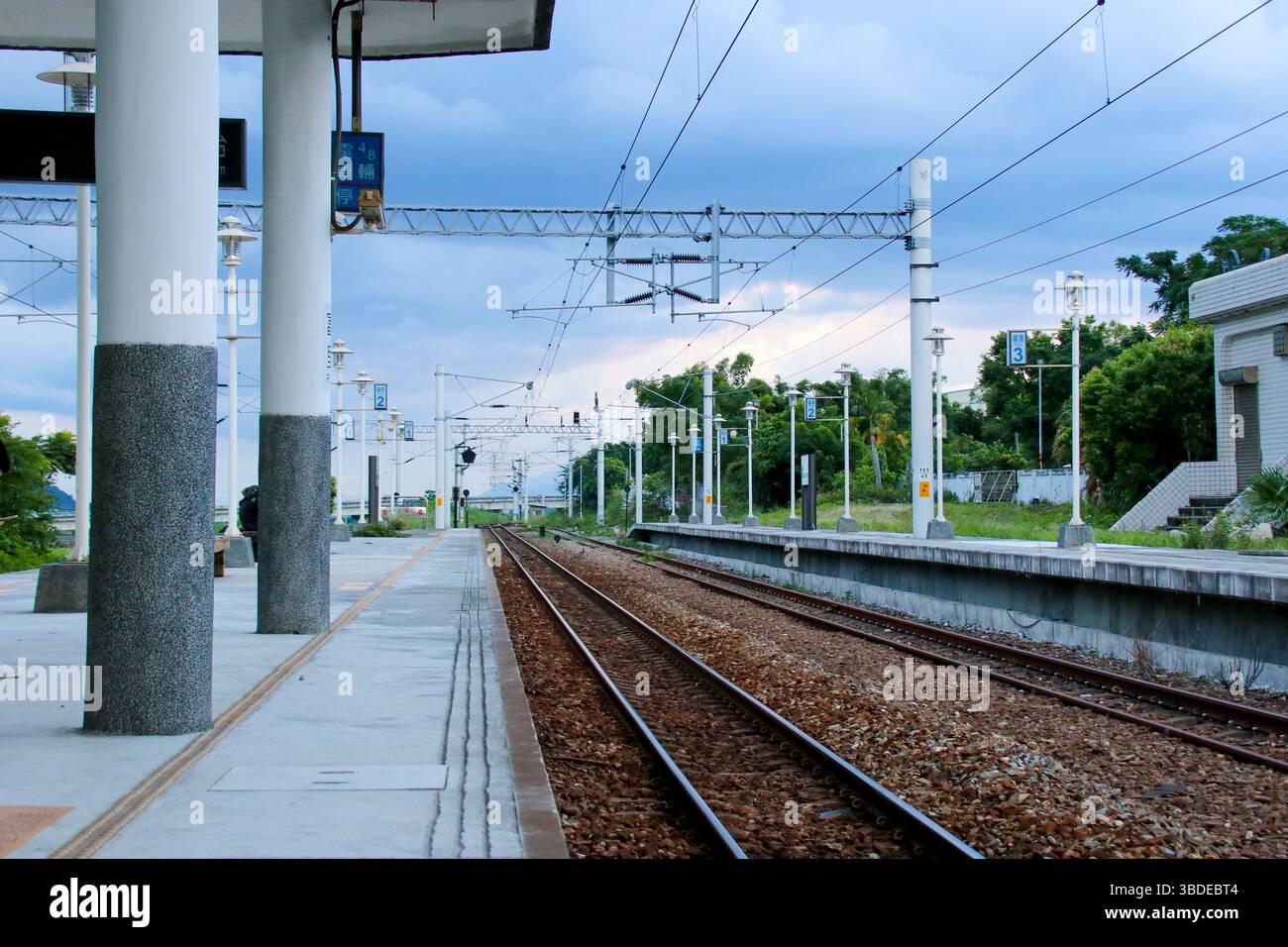 Taiwan May 21, 2024: A railway track curving into the distance beside a ...
