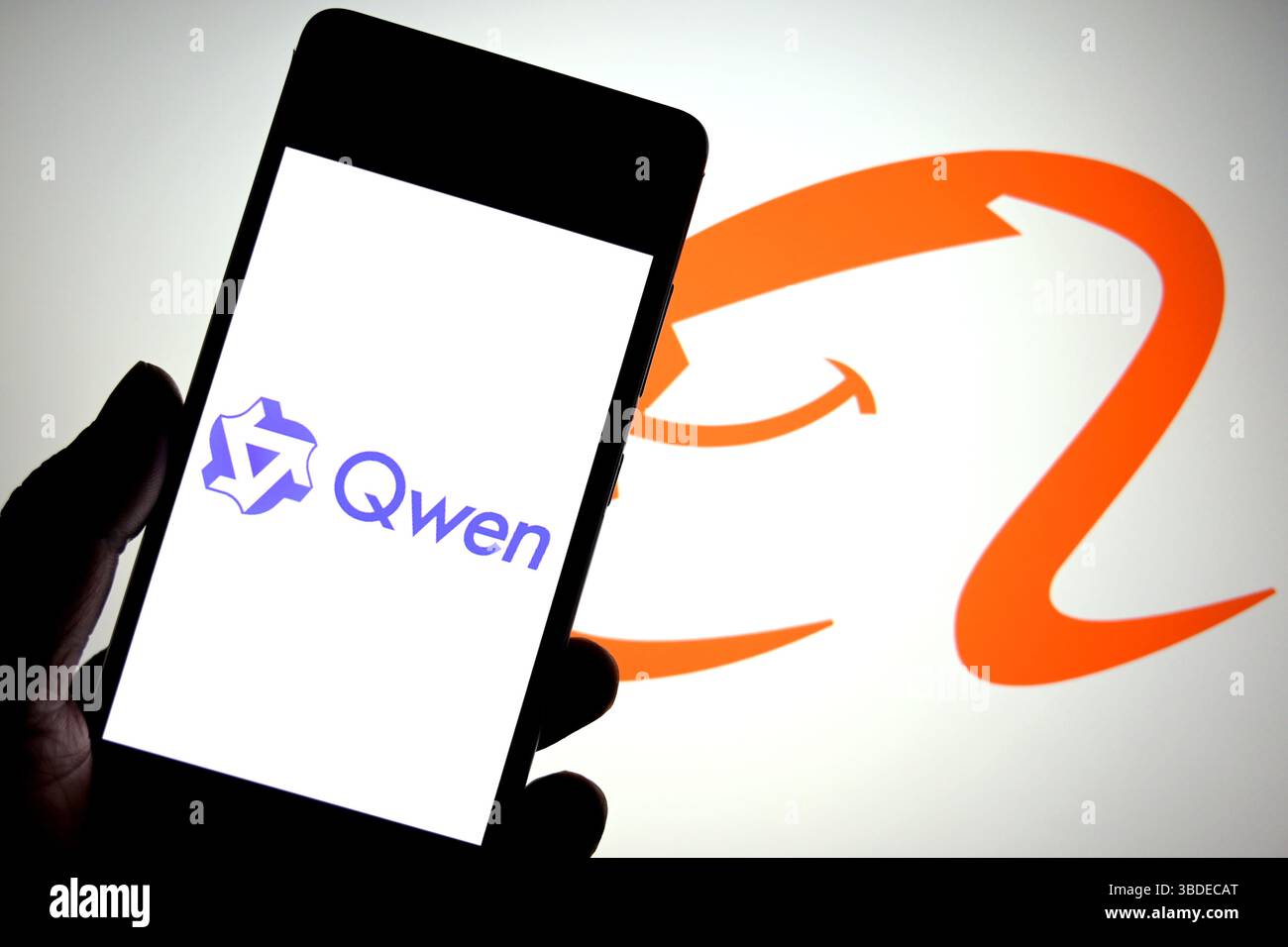 In this photo illustration, a QWEN logo is seen displayed on a ...
