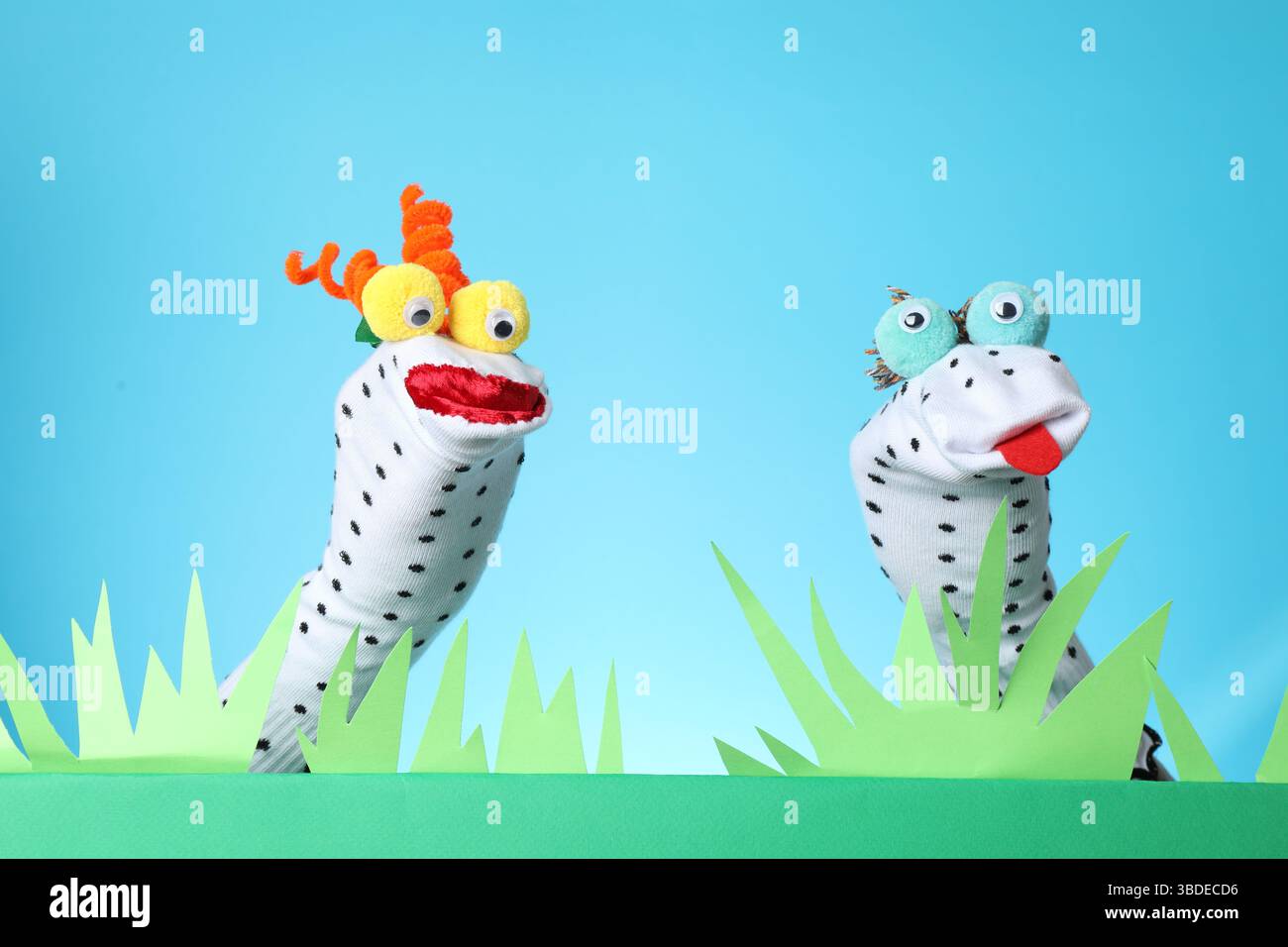 Creative puppet show on stage with decorations against light blue ...