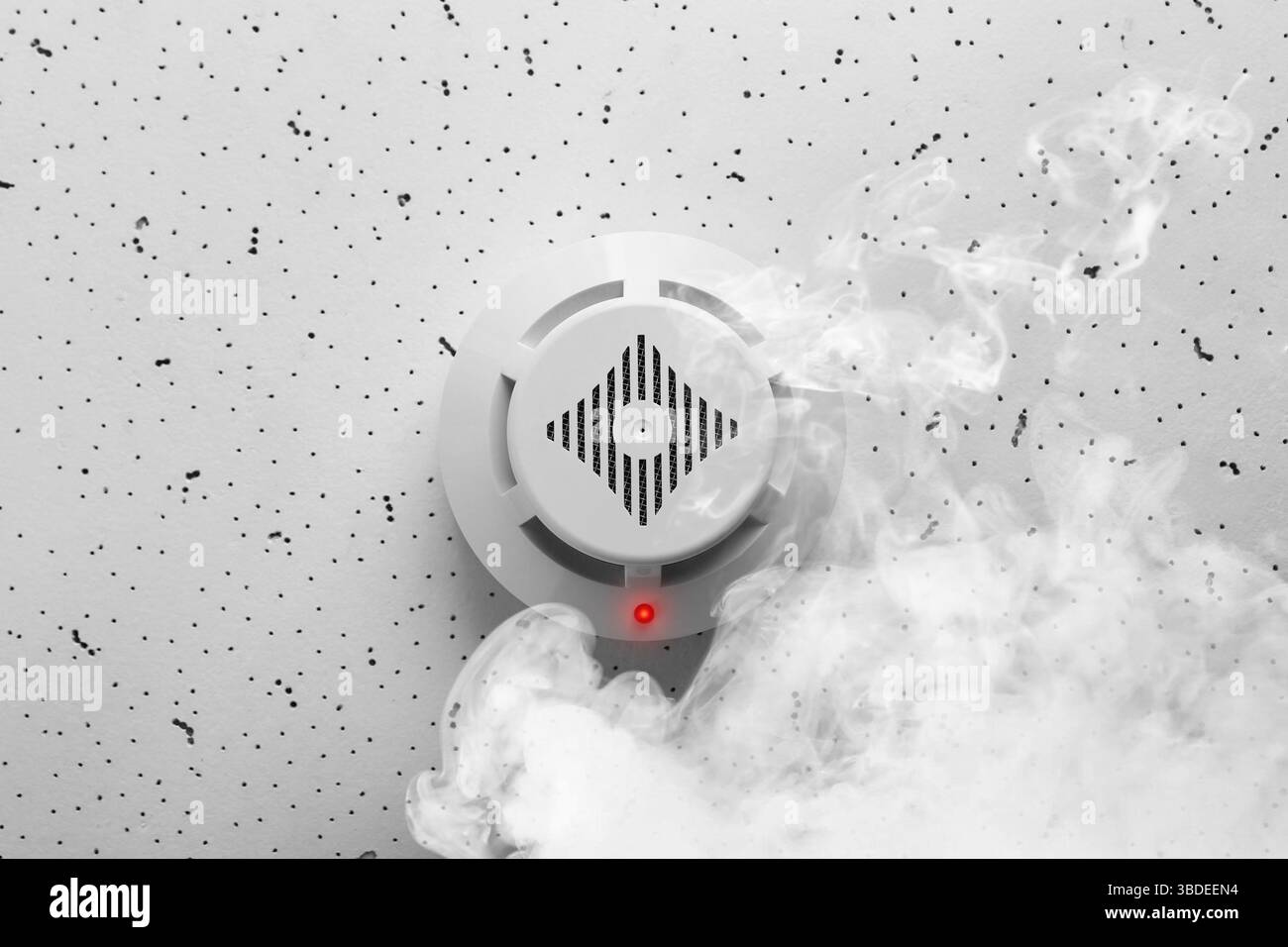 Fire alarm system. Detector on ceiling triggered by smoke, bottom view ...