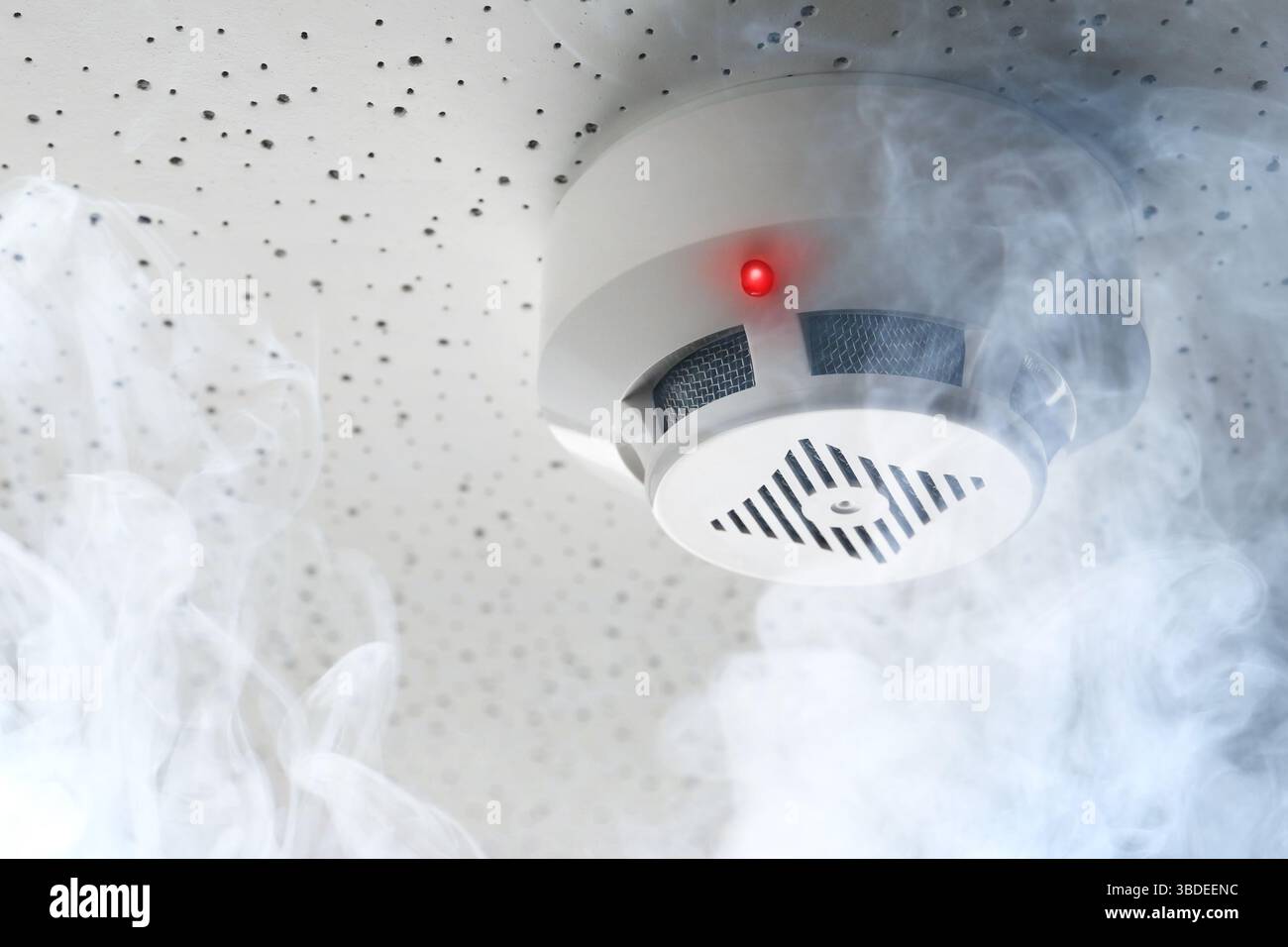 Fire alarm system. Detector on ceiling triggered by smoke Stock Photo ...