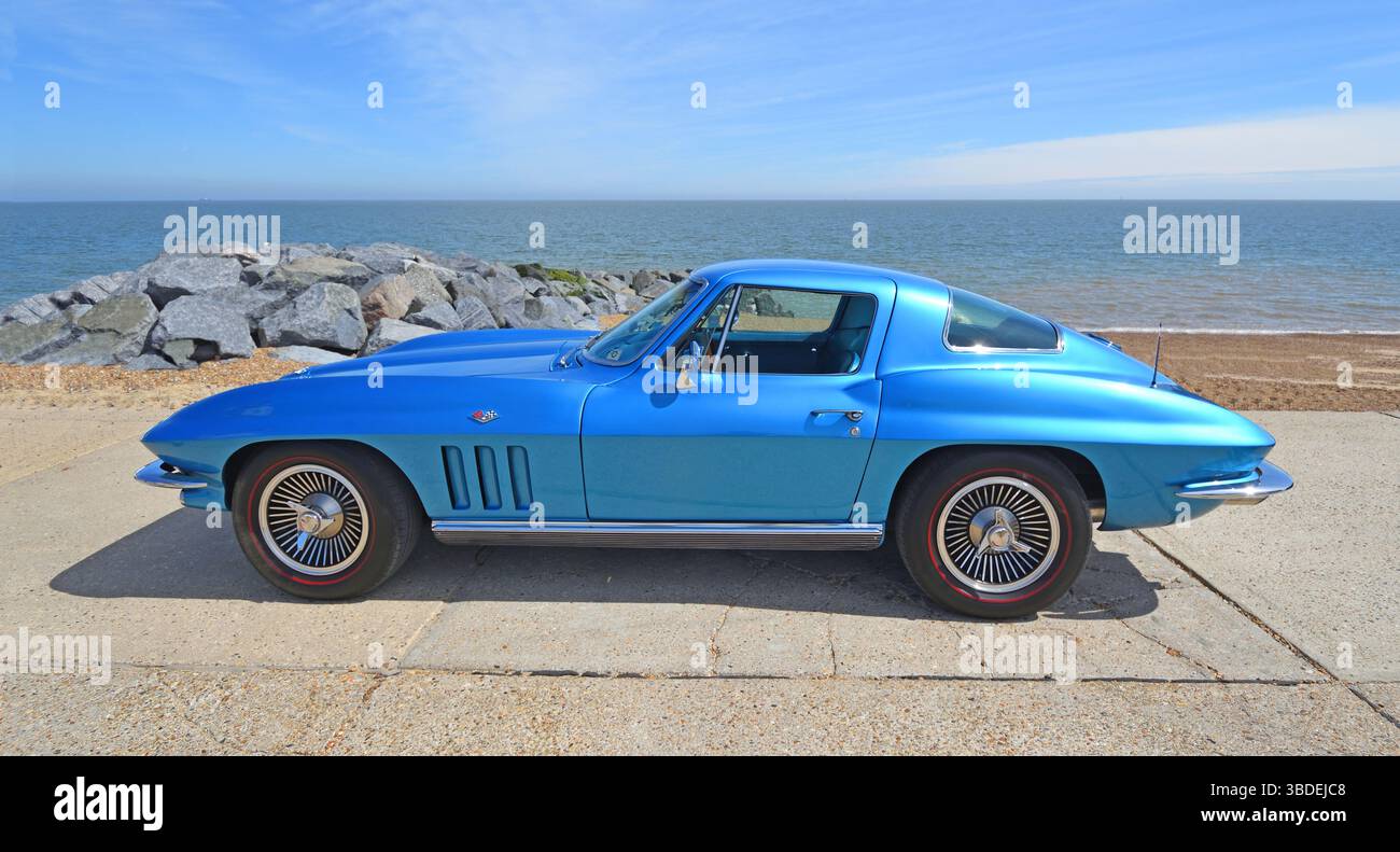 Classic Chevrolet Corvette C2 parked on seafront promenade beach and ...