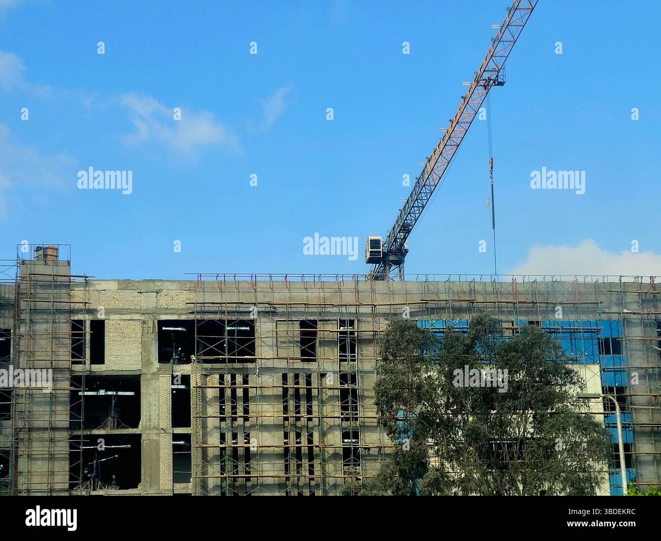 Cairo, Egypt, May 20 2025: A new high rise of new hospital with a crane ...