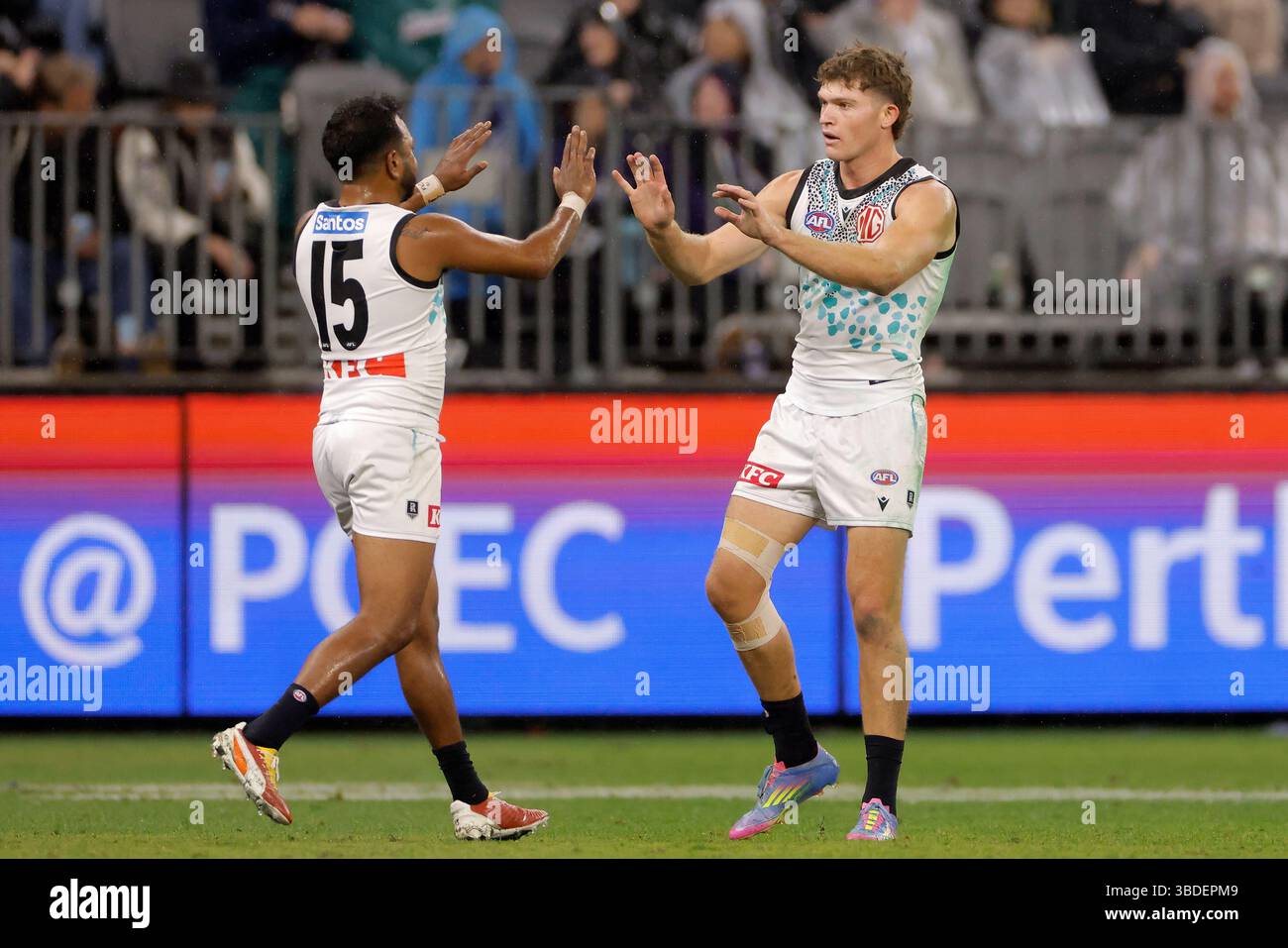 Perth, Australia. 24th May, 2025. Mitch Georgiades (right) of the Power ...