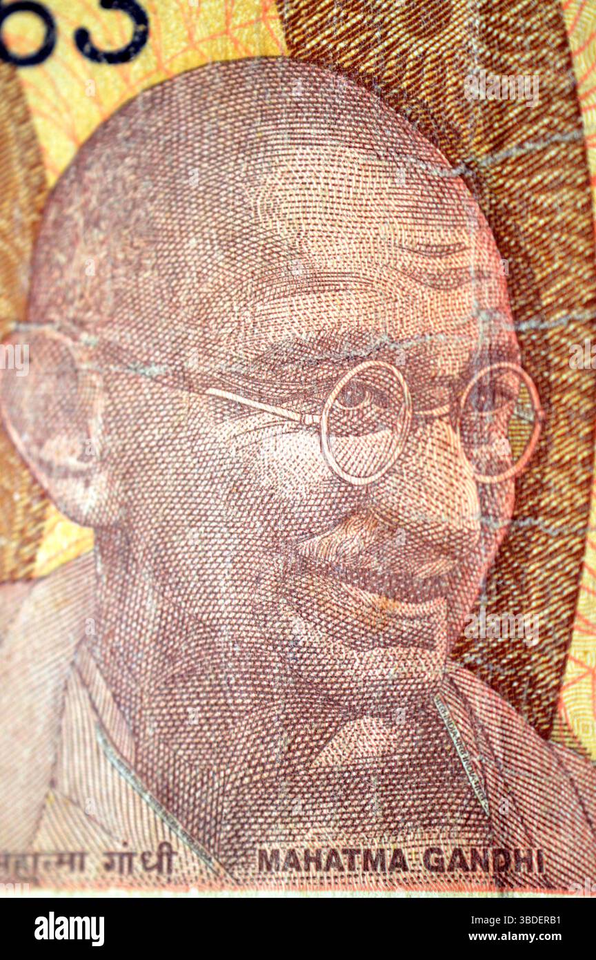 a portrait of Mahatma Gandhi at left center from the obverse side of ...