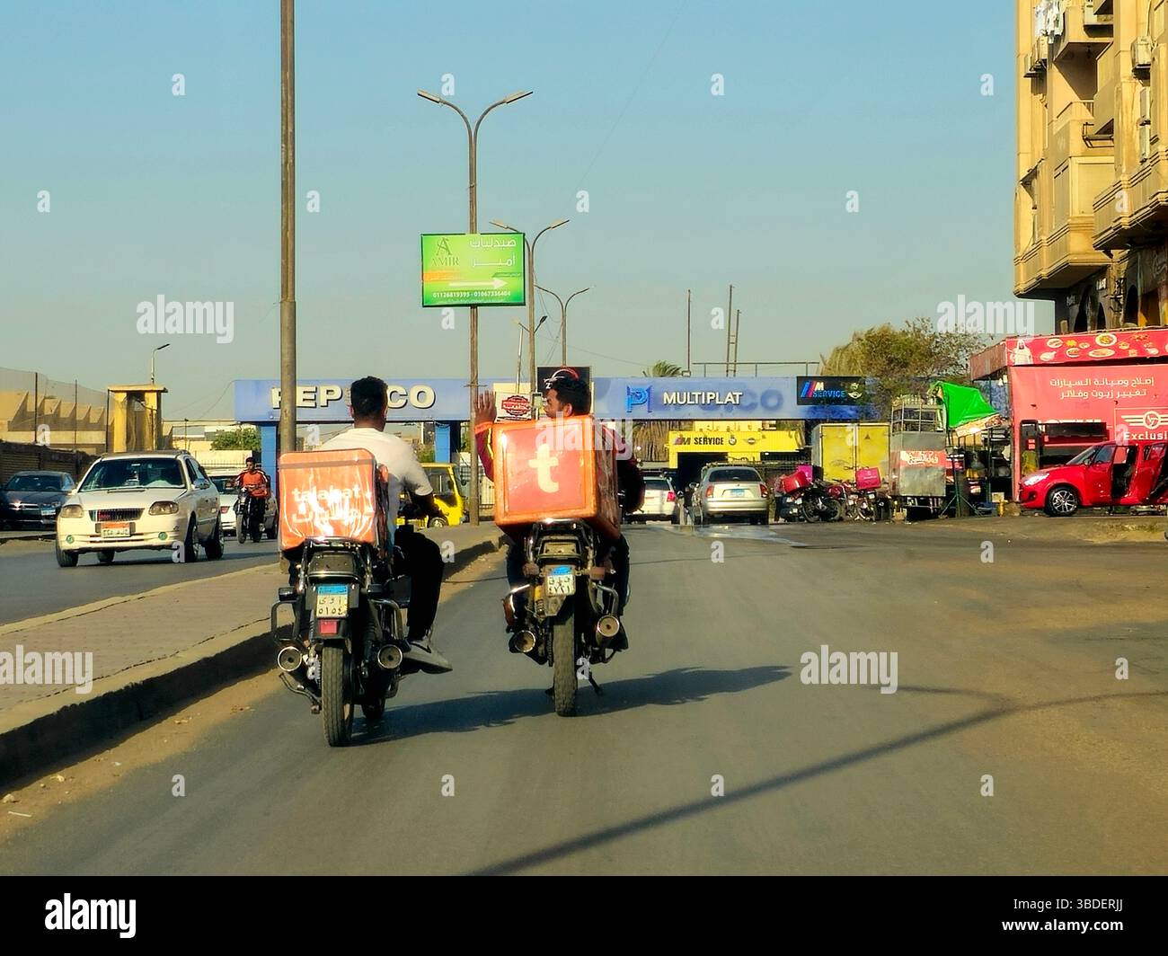 Cairo, Egypt, May 20 2025: Talabat motorcycles delivery service of Food, groceries and more ...