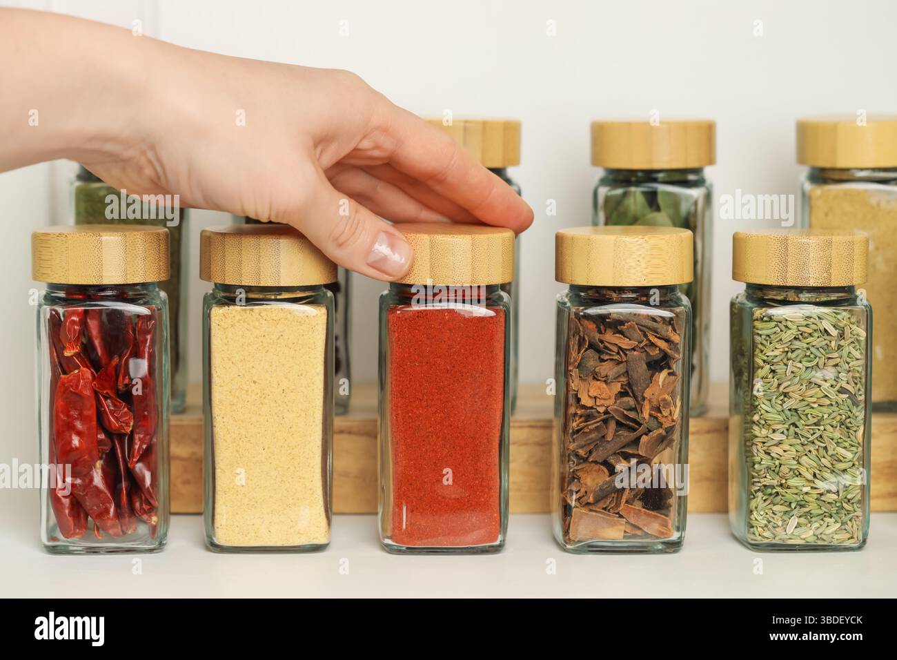 Woman taking jar spice hi-res stock photography and images - Alamy
