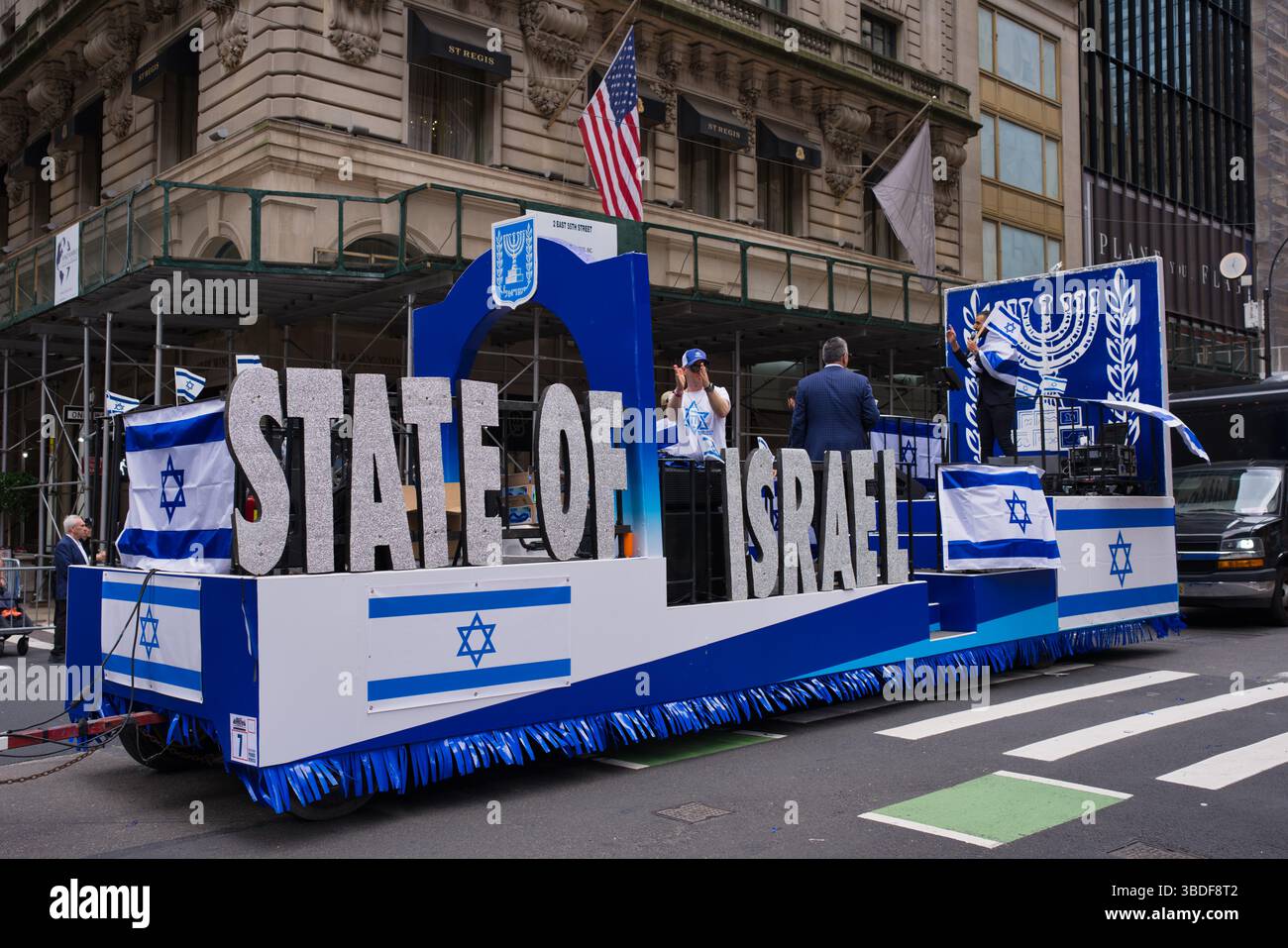 A parade float celebrating the State of Israel. Dominated by blue and ...