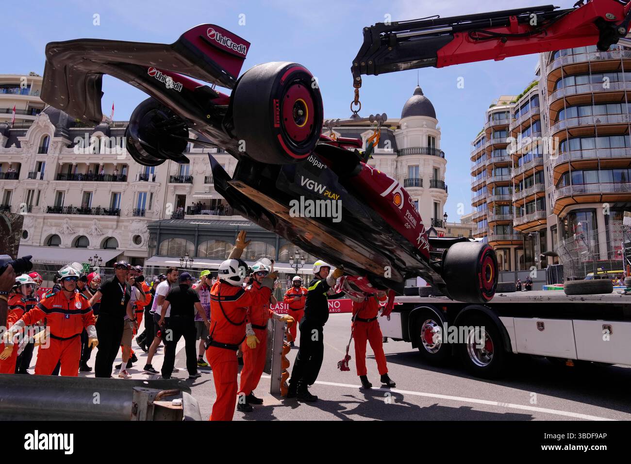 The car of Ferrari driver Lewis Hamilton of Britain is lifted for ...
