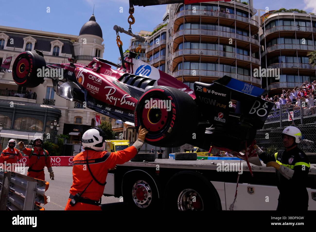The car of Ferrari driver Lewis Hamilton of Britain is lifted for ...