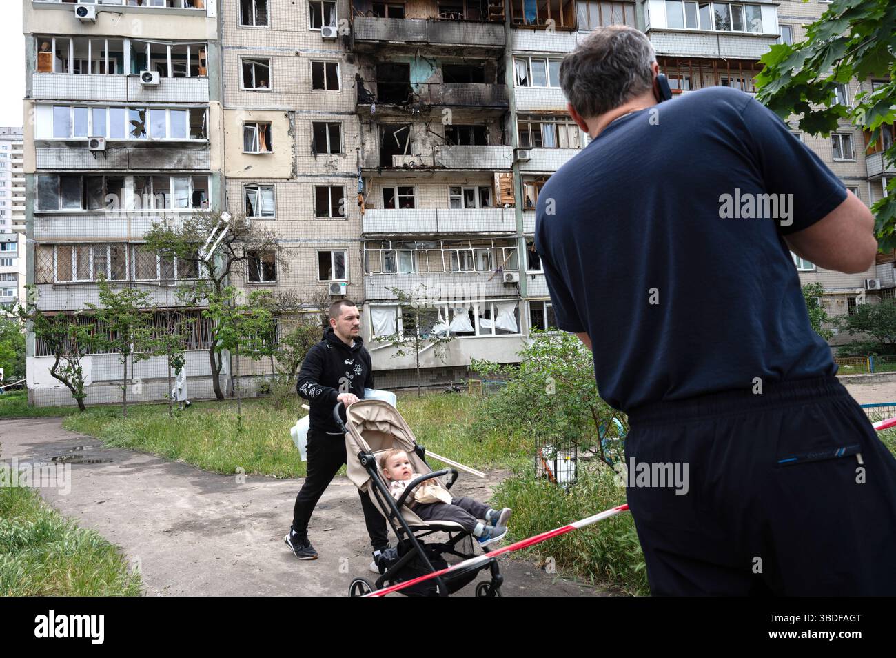 Kyiv, Ukraine. 24th May, 2025. A man pushes a stroller with a baby ...