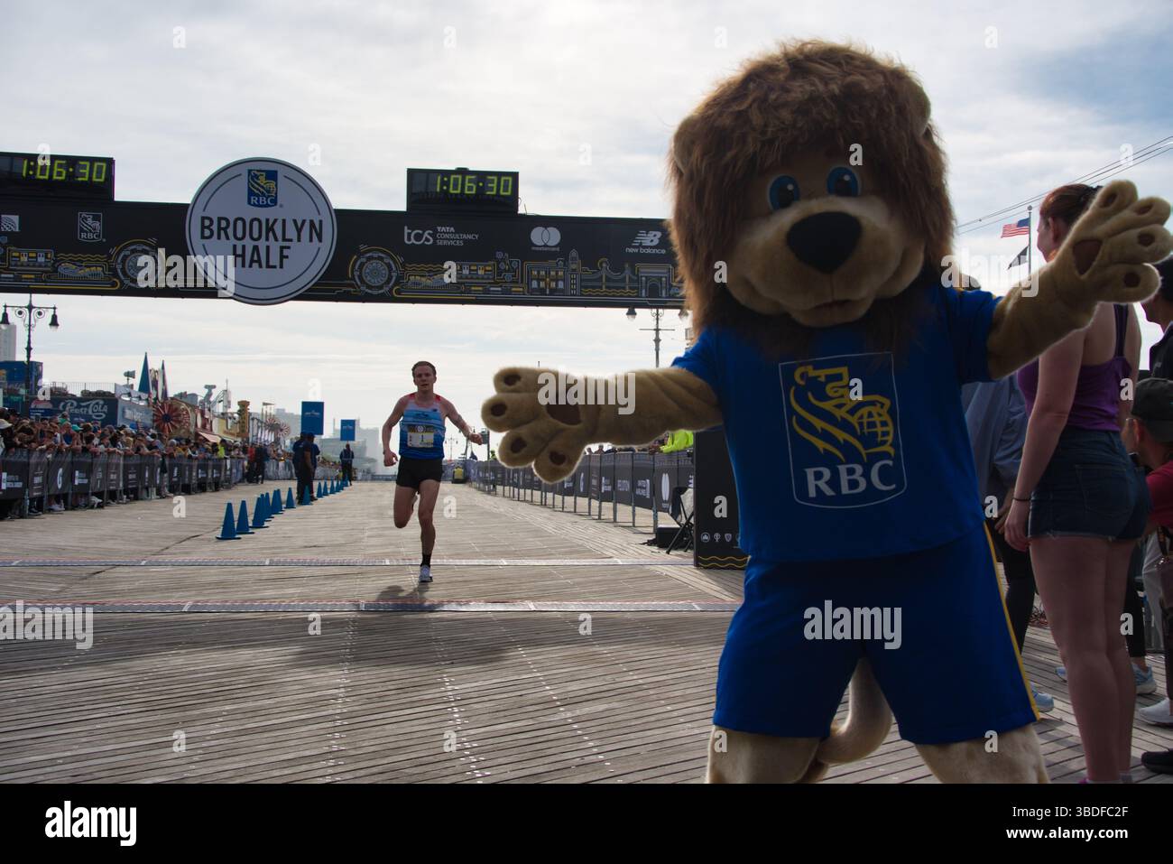 A male runner nears the finish line of the Brooklyn Half marathon, a ...