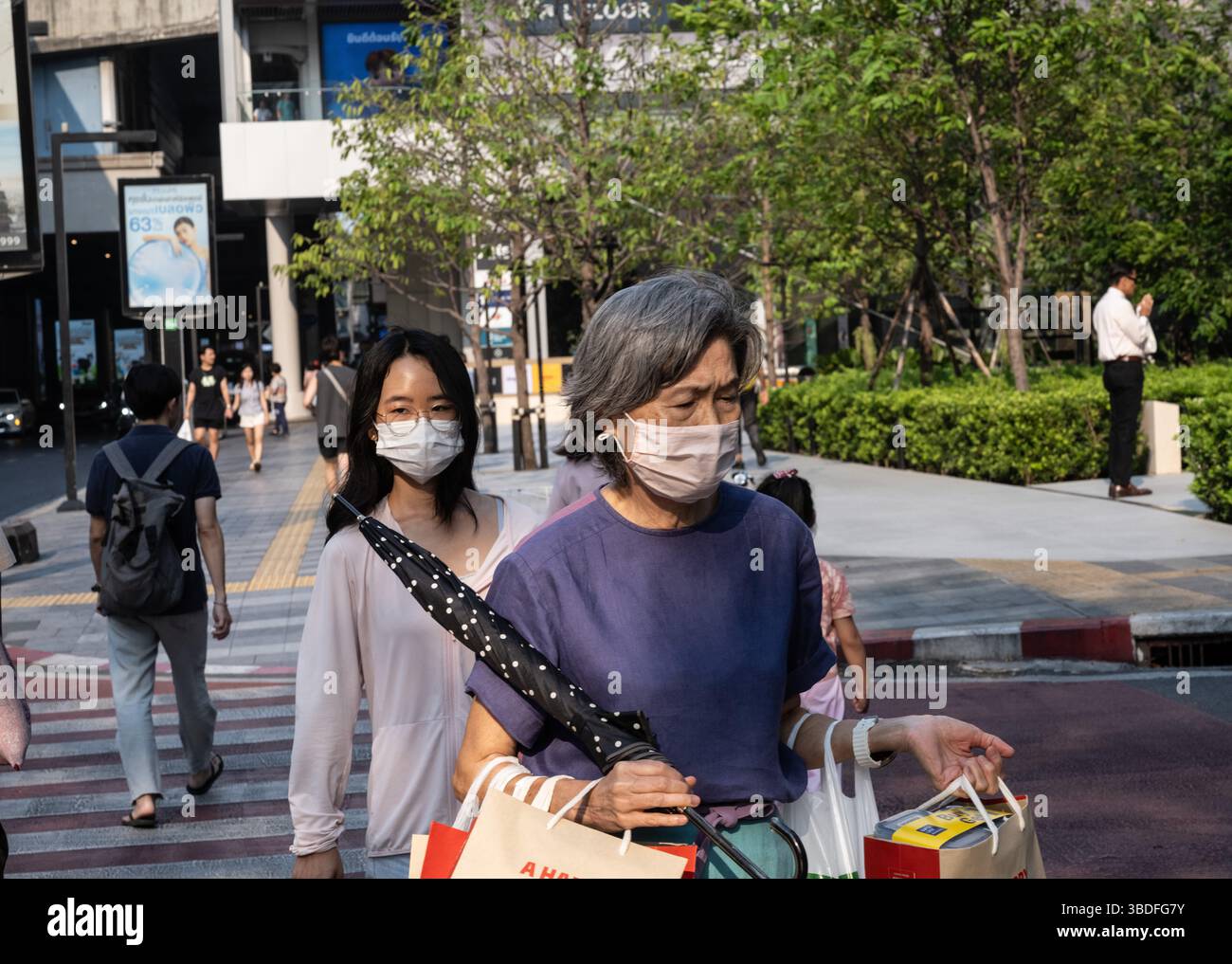 Bangkok, Thailand. March 25th 2025 Local women wearing face masks to ...