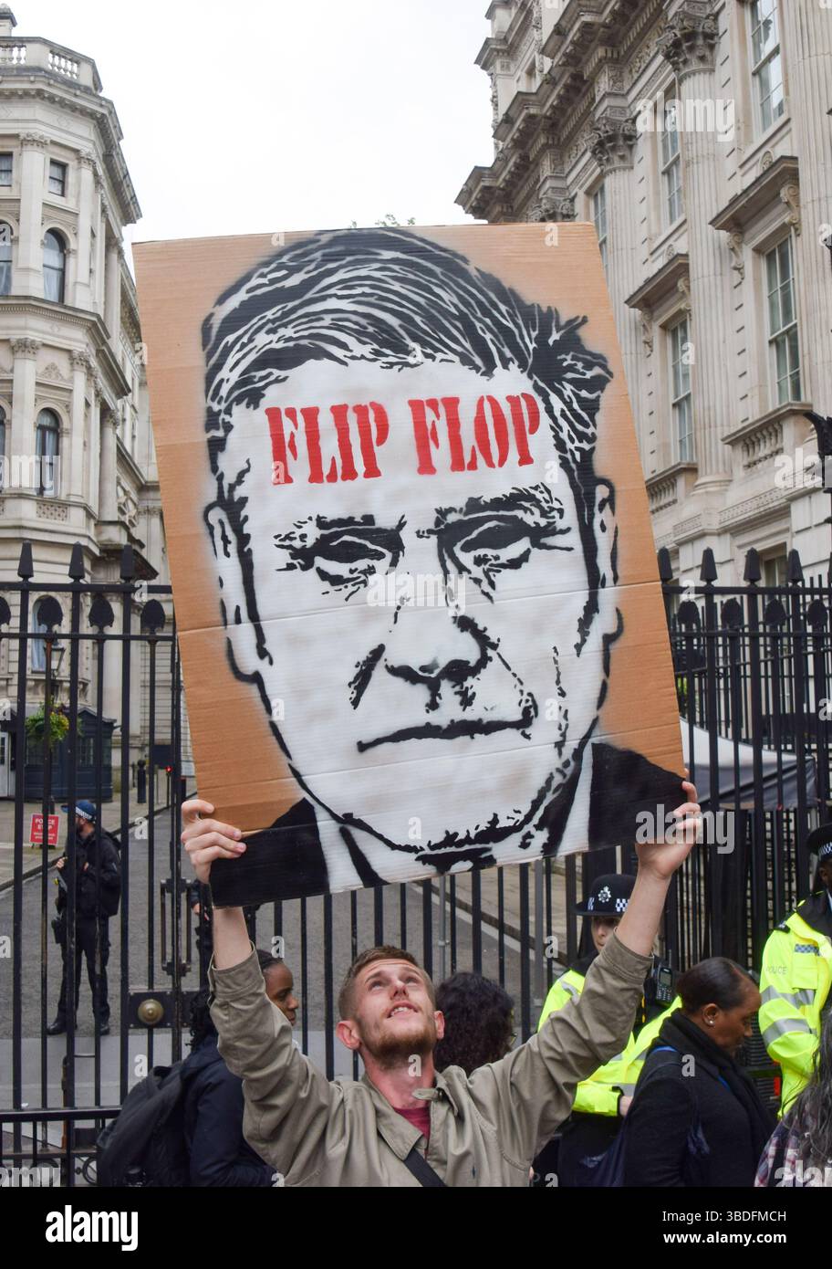 London, England, UK. 24th May, 2025. A protester holds a sign referring ...