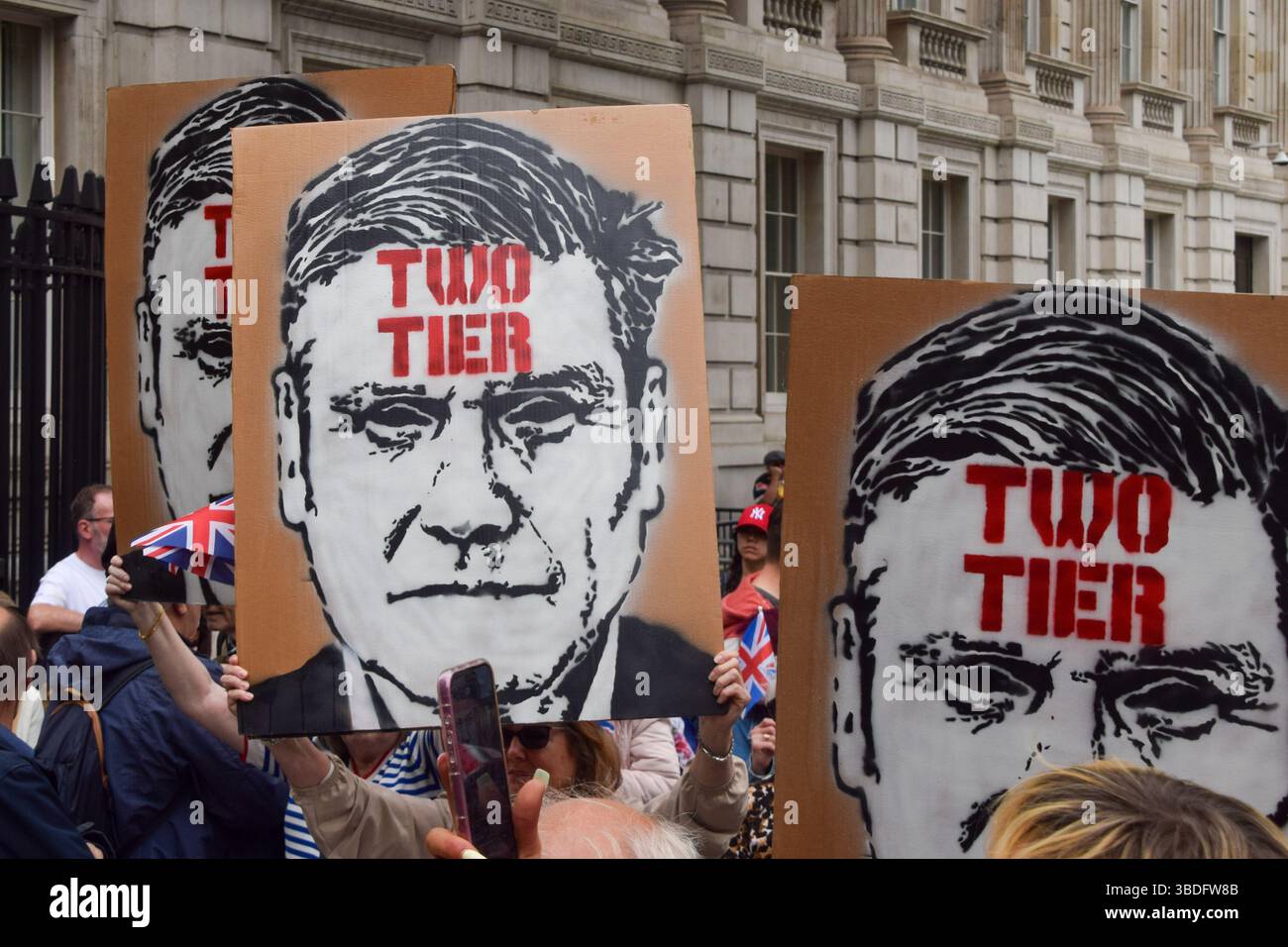 London, UK. 24th May 2025. Protesters hold signs referring to Keir ...