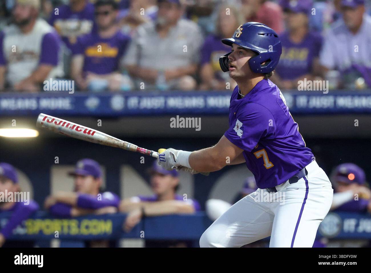 HOOVER, AL - MAY 23: LSU utility Jake Brown (7) watches the ball after ...