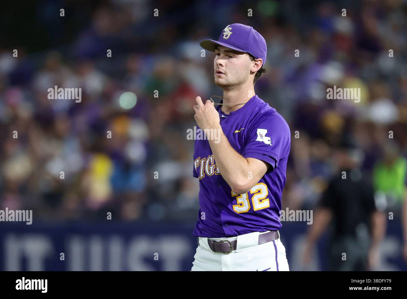 HOOVER, AL - MAY 23: LSU pitcher Kade Anderson (32) fixes his necklace ...