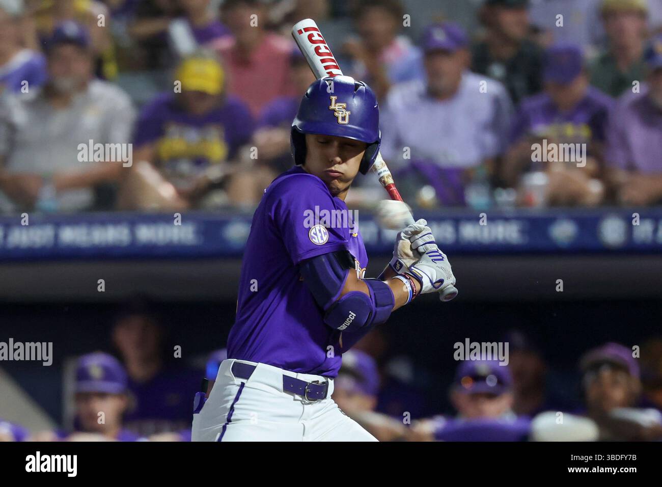 HOOVER, AL - MAY 23: LSU outfielder Derek Curiel (6) twists out of the ...
