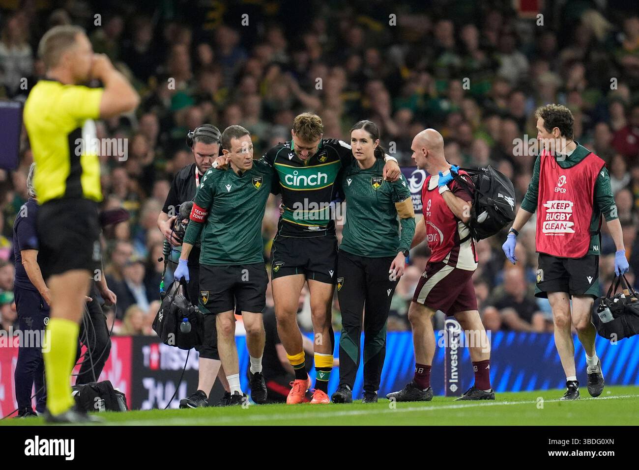Northampton Saints' James Ramm (centre) is forced off the field with an ...