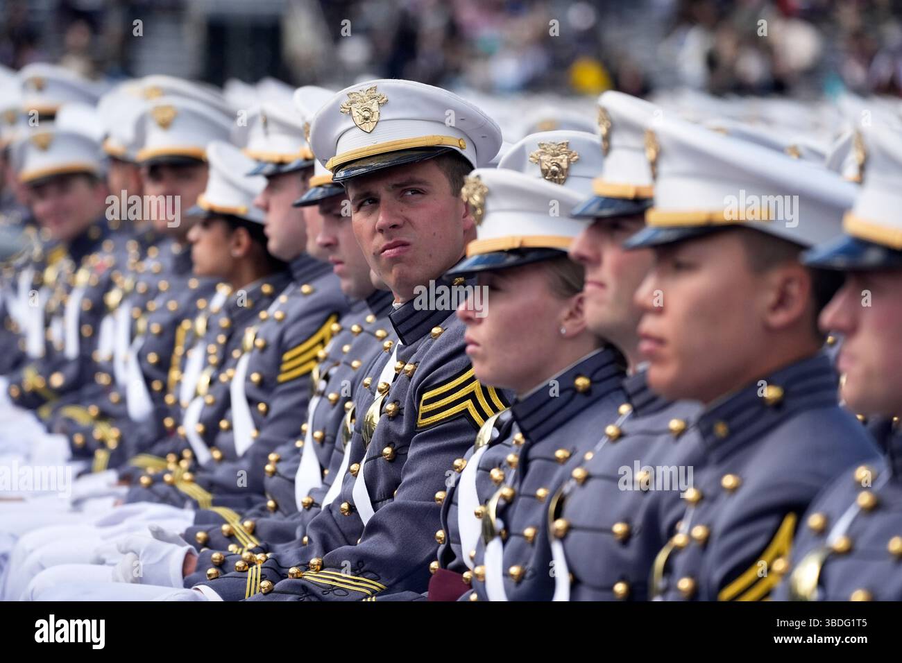 United States Military Academy graduating cadets sit during ...