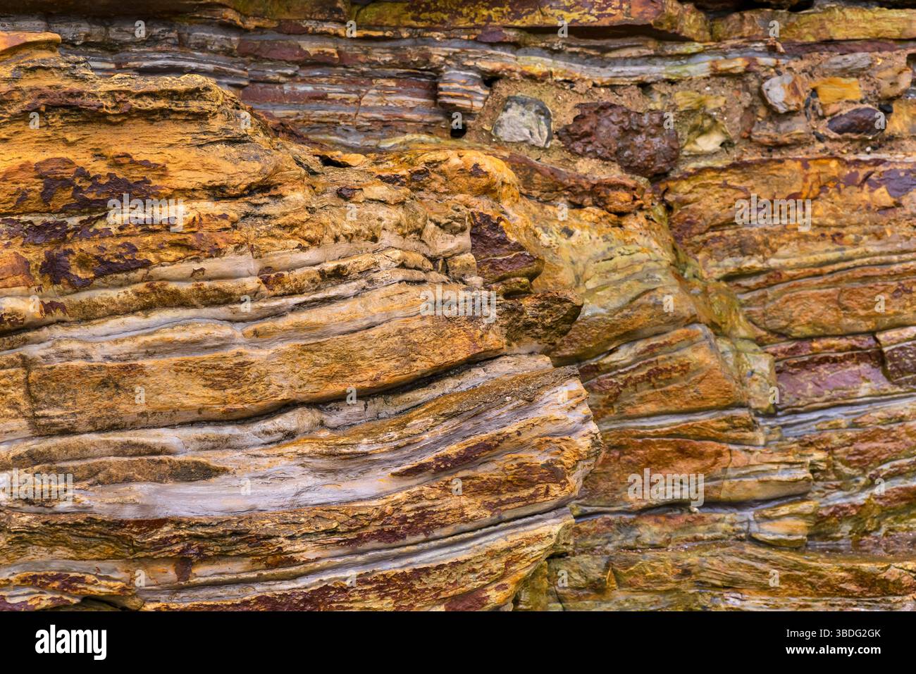 Spectacular strongly-bedded Jurassic sandstone with mineral veins and ...