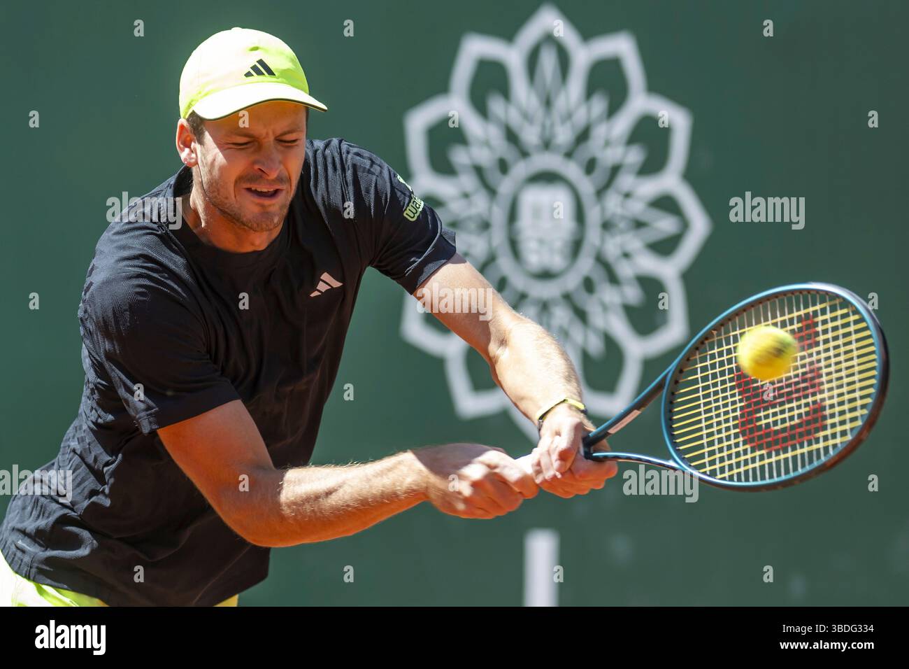 Hubert Hurkacz of Poland returns a ball to Novak Djokovic of Serbia ...