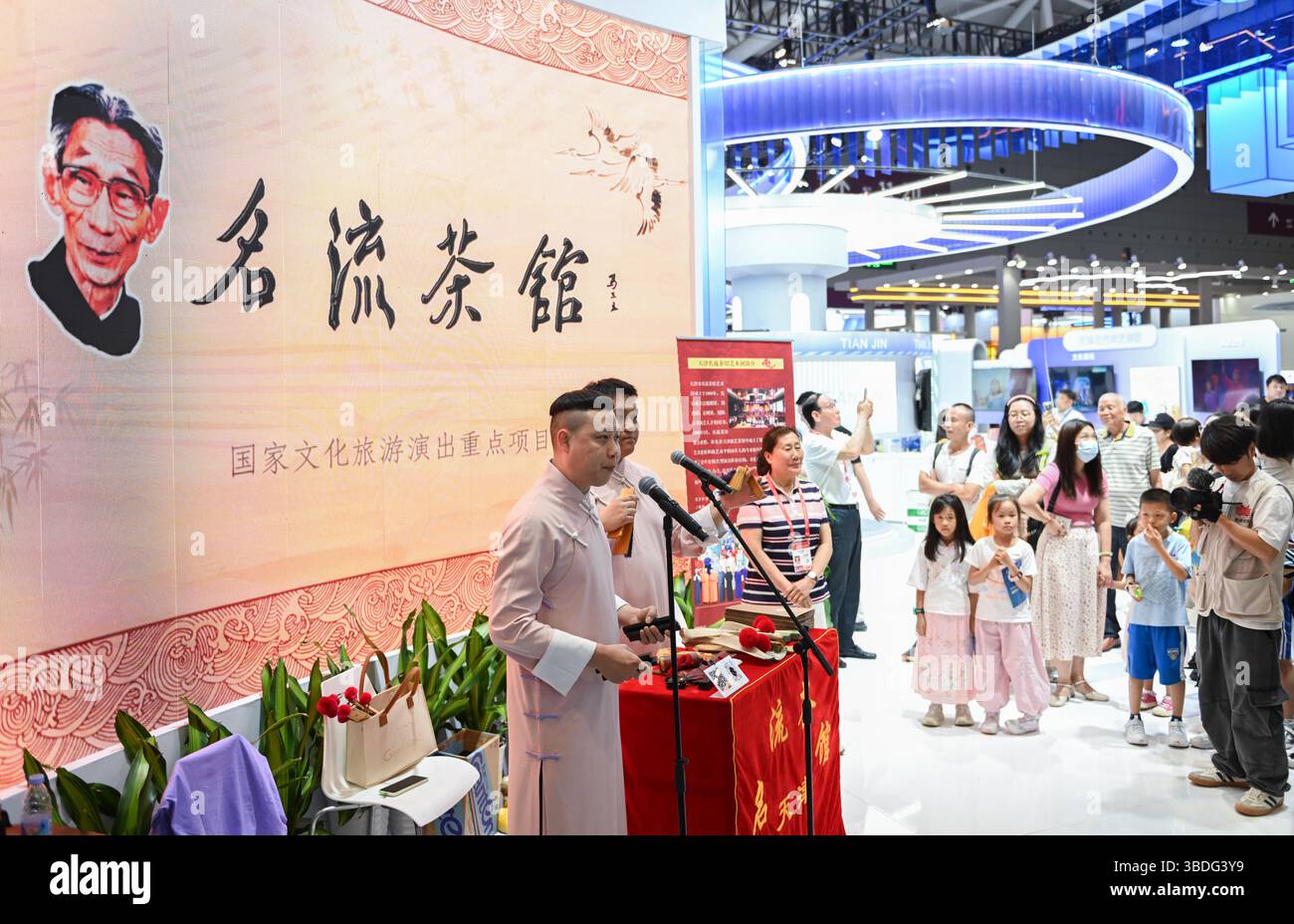 Shenzhen, China's Guangdong Province. 24th May, 2025. Visitors watch a ...