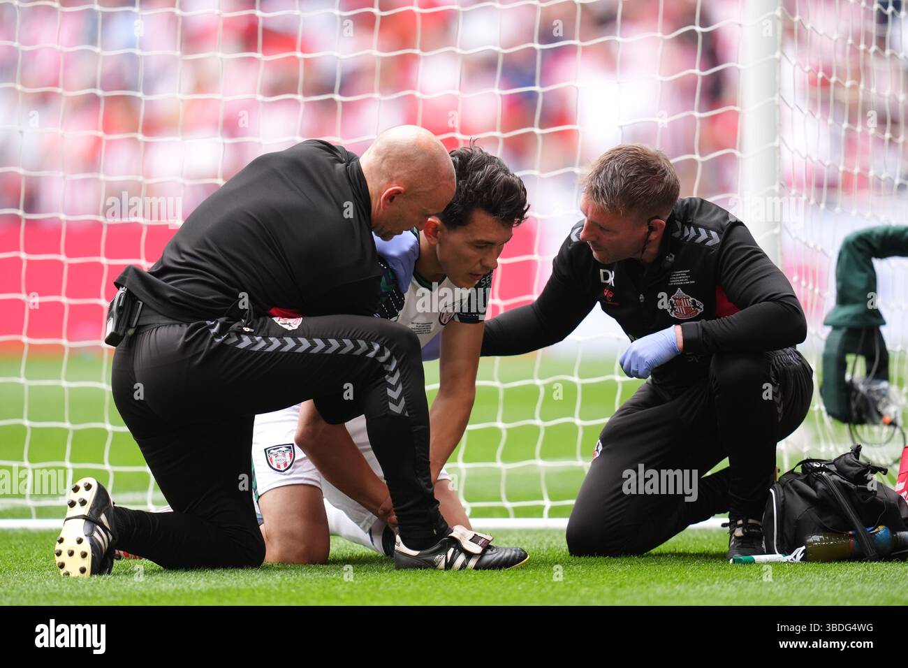 Sunderland's Luke O'Nien receives treatment for an injury during the ...