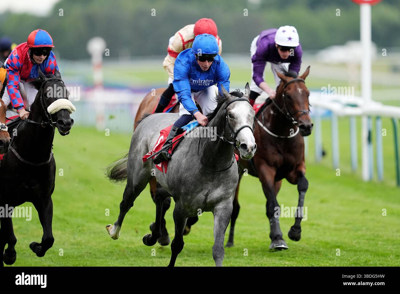 Symbol Of Honour ridden by William Buick (centre) on their way to ...