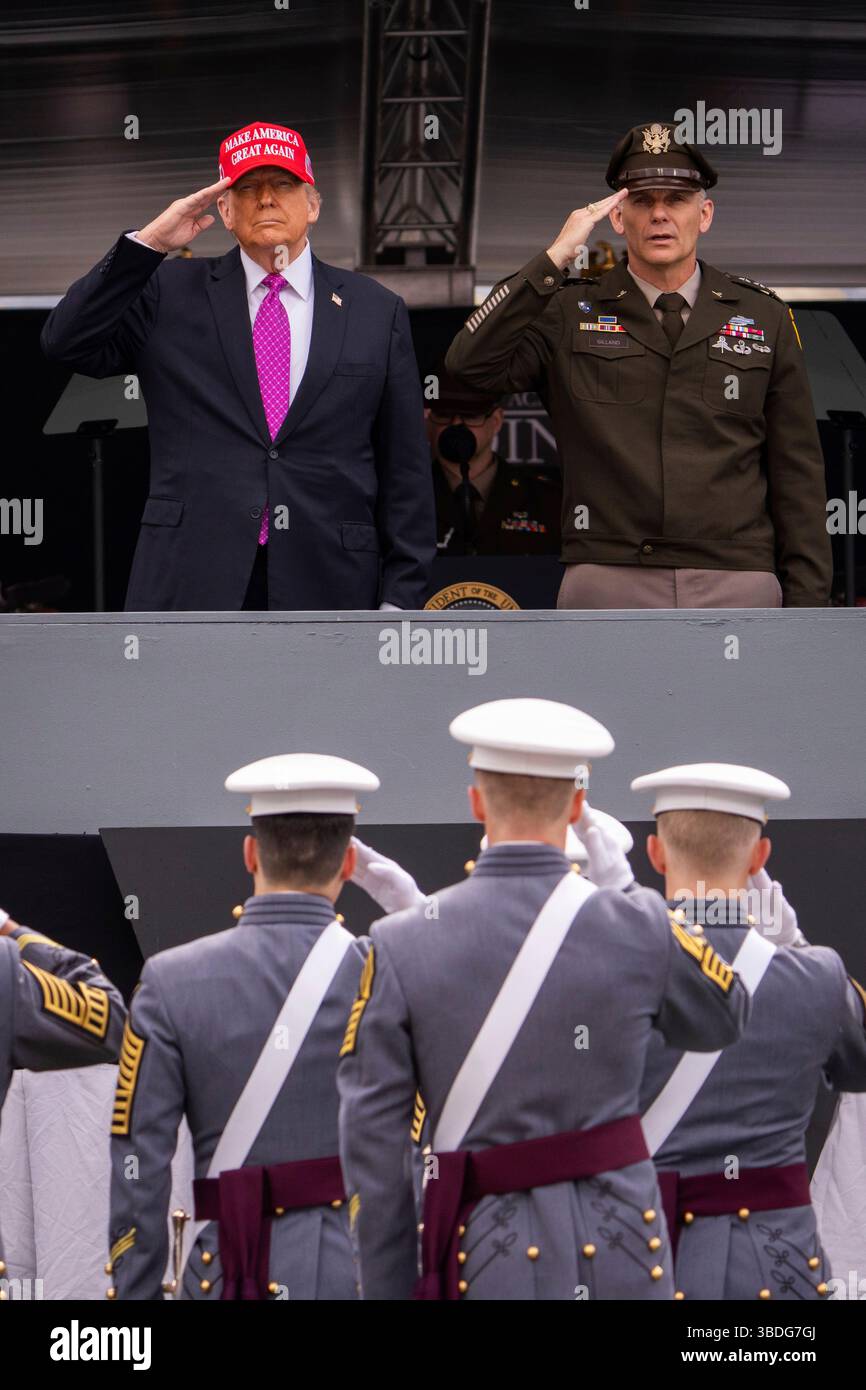 President Donald Trump, left, salutes alongside U.S. Military Academy ...