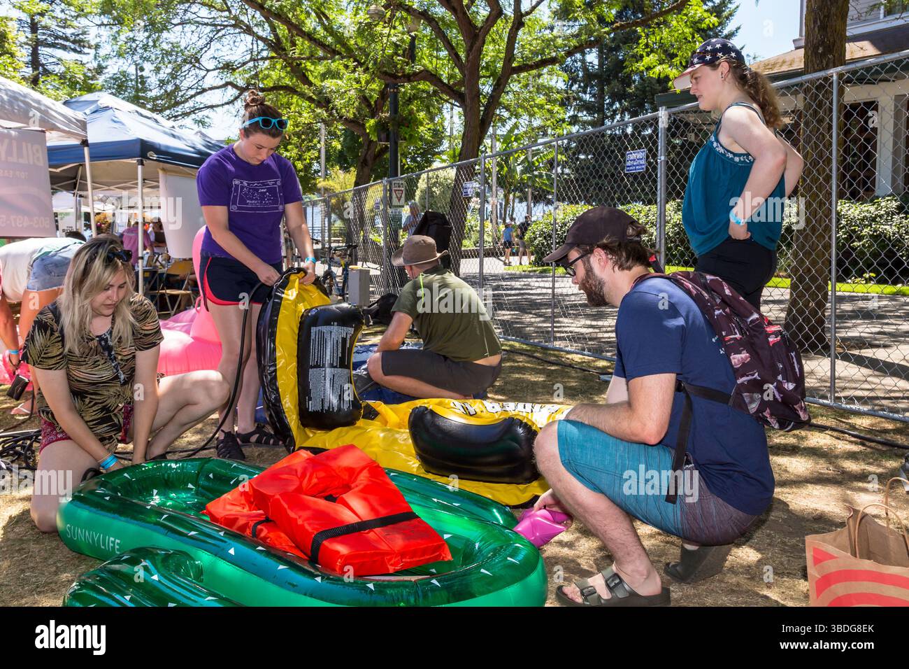 The Big Float, Portland, Oregon - July 14th 2018: People inflate rafts ...