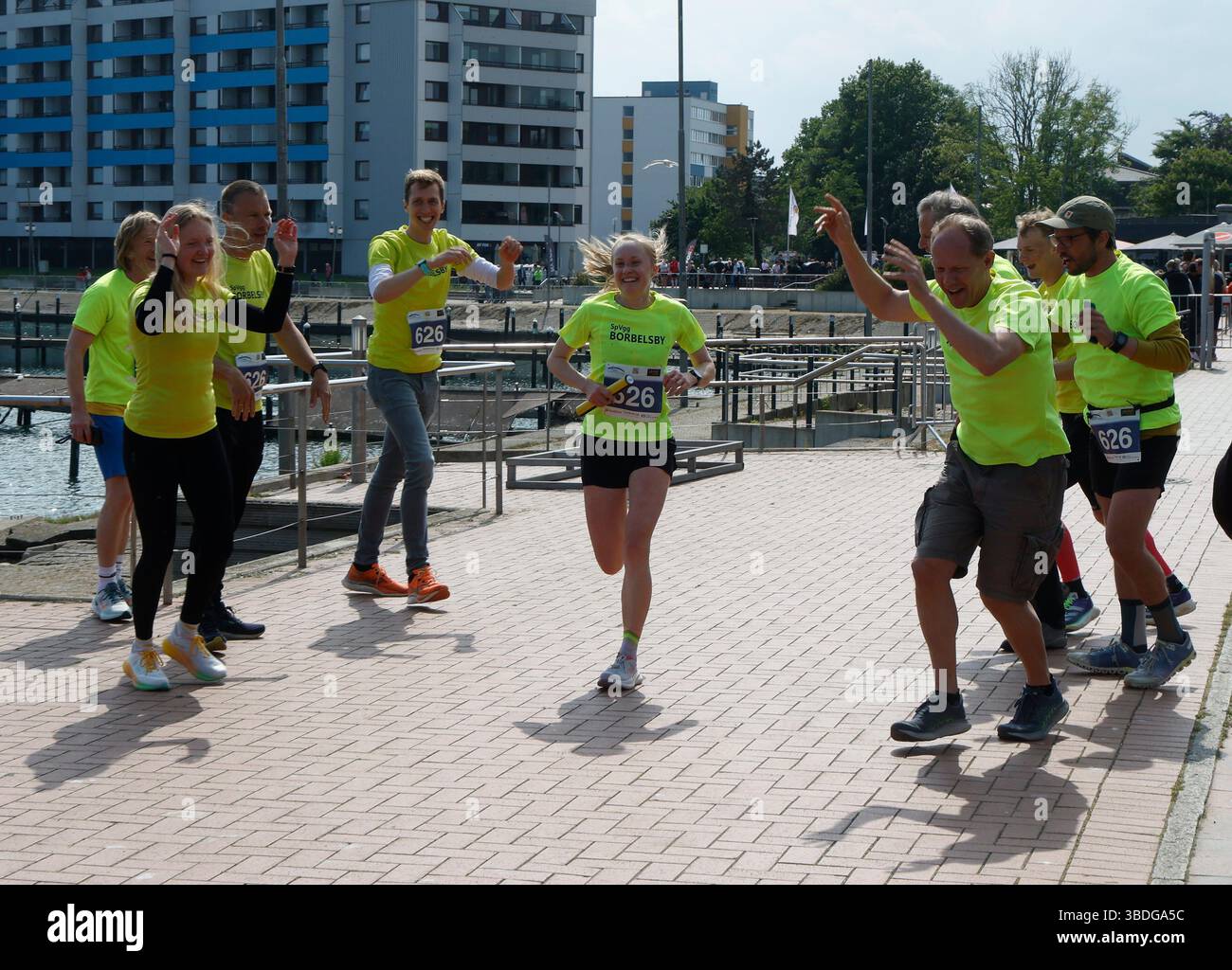 Damp, Germany. 24th May, 2025. A running group crosses the finish line ...