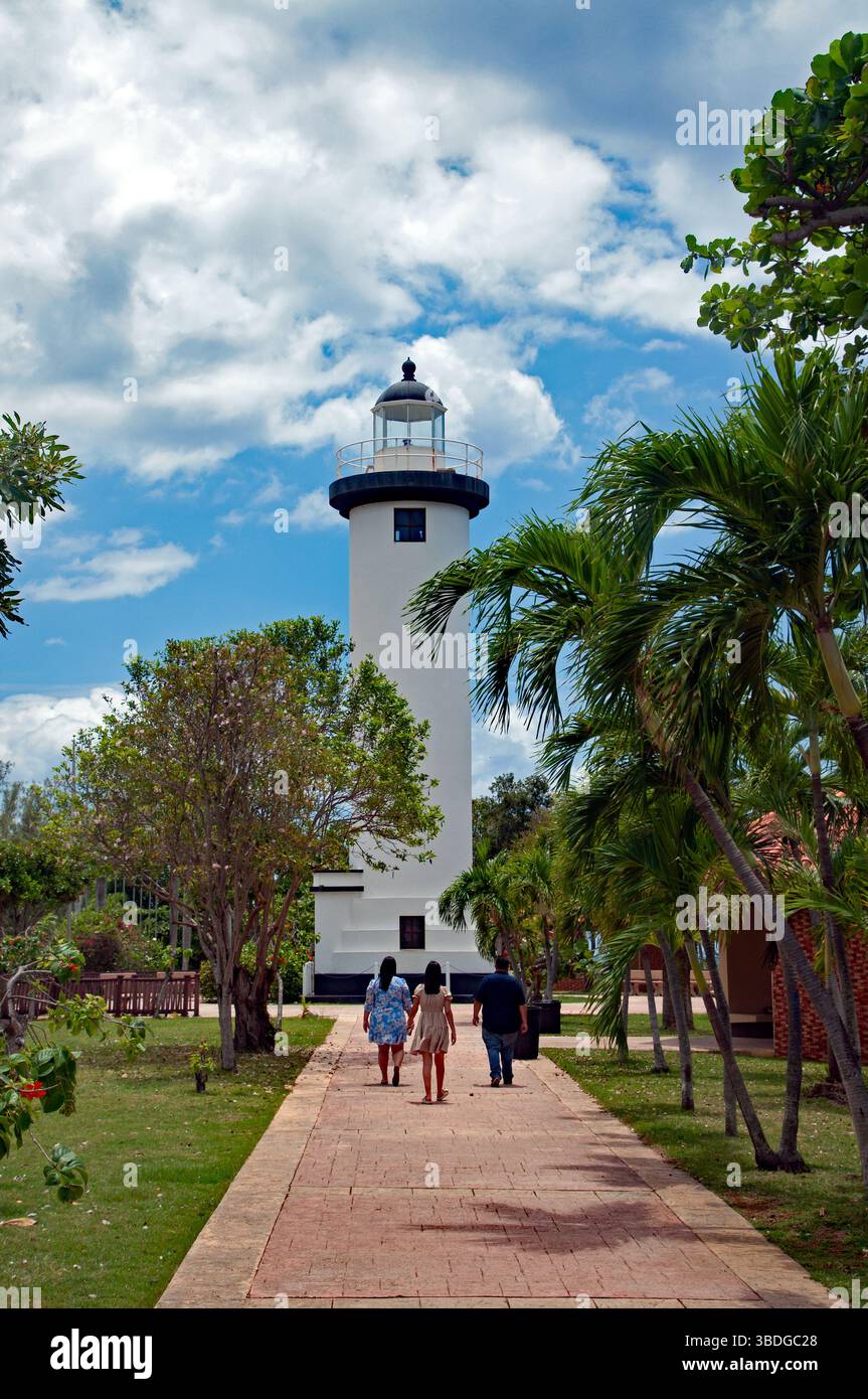 Family walking towards Punta Higuero Lighthouse, Rincon, Puerto Rico ...